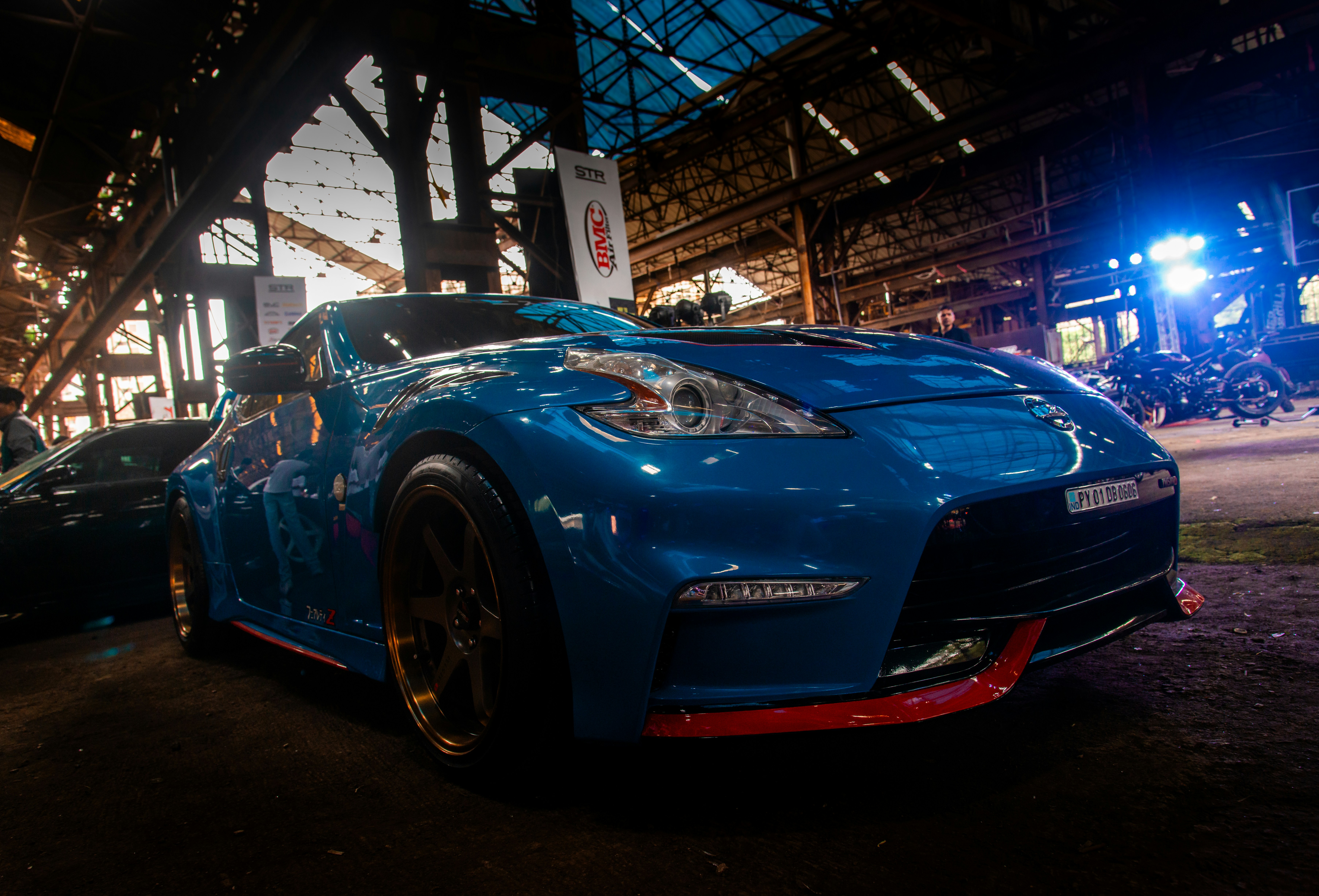 Midnight Blue Vigor: A Sleek Sports Car Awaits the Neon Horizon