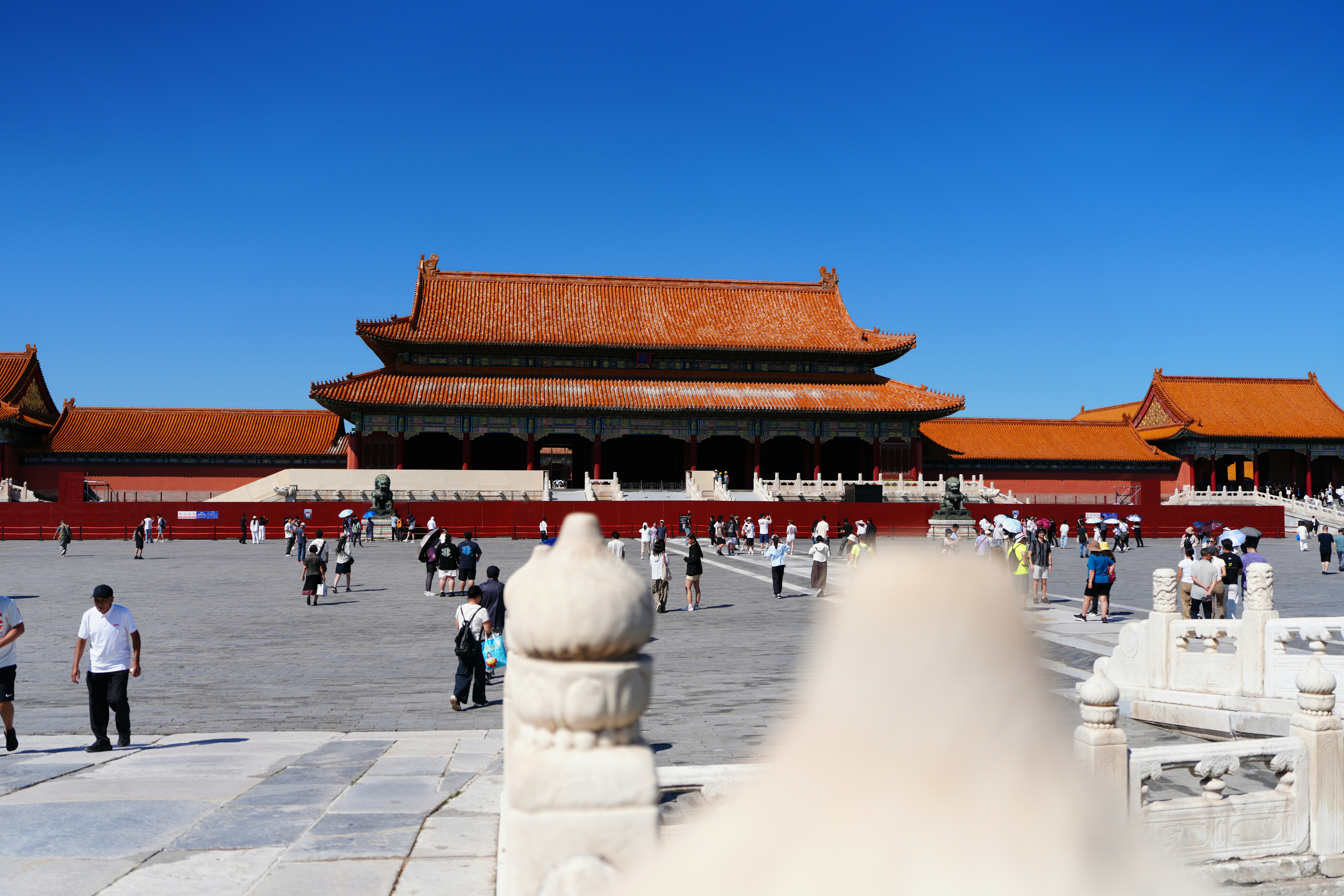 Red Gate Courtyard: Lone Center of Focus Beneath a Clear Blue Sky