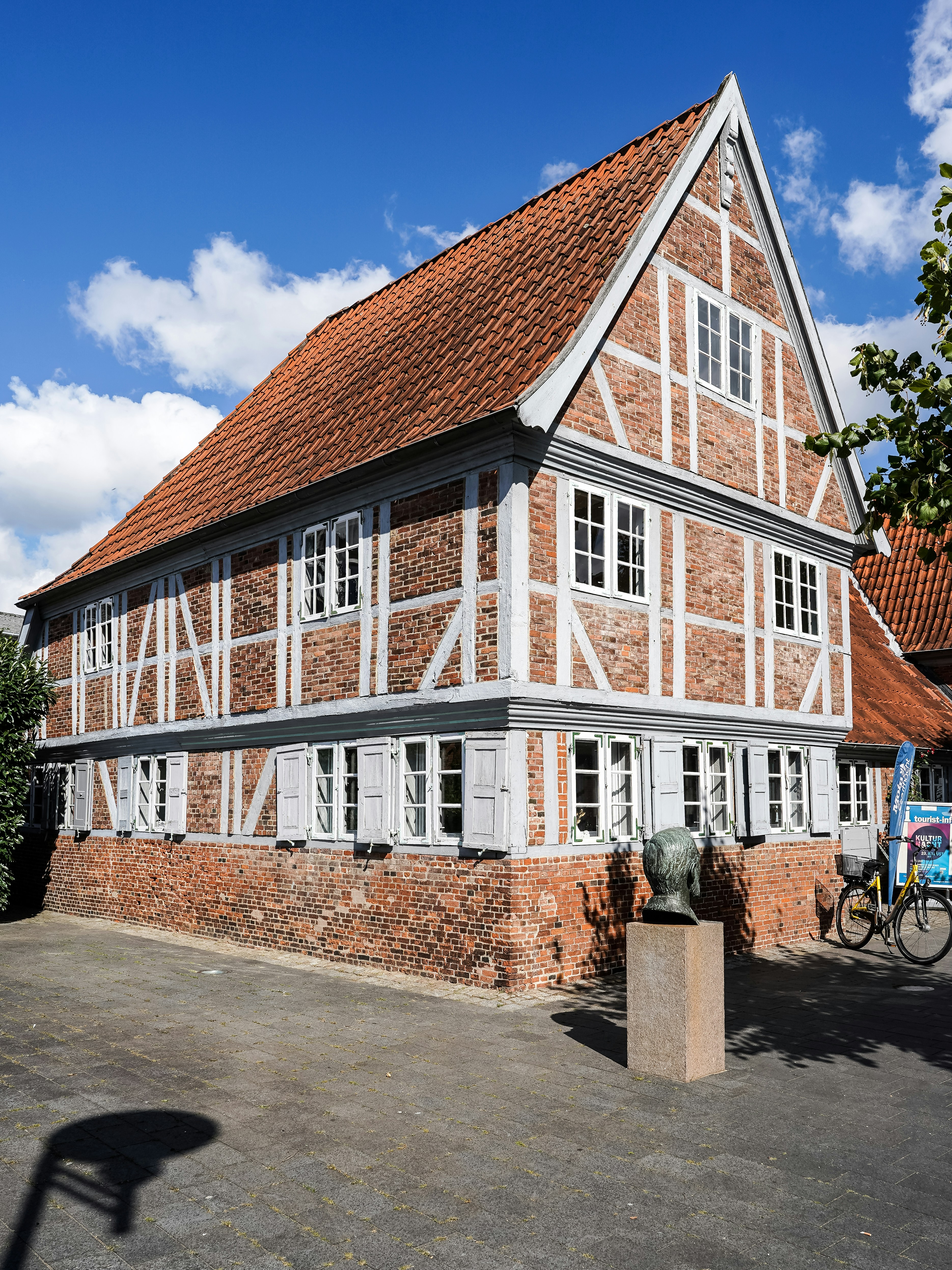 Timbered Brick Heritage: A classic Danish-style House Basks Under a Clear Sky