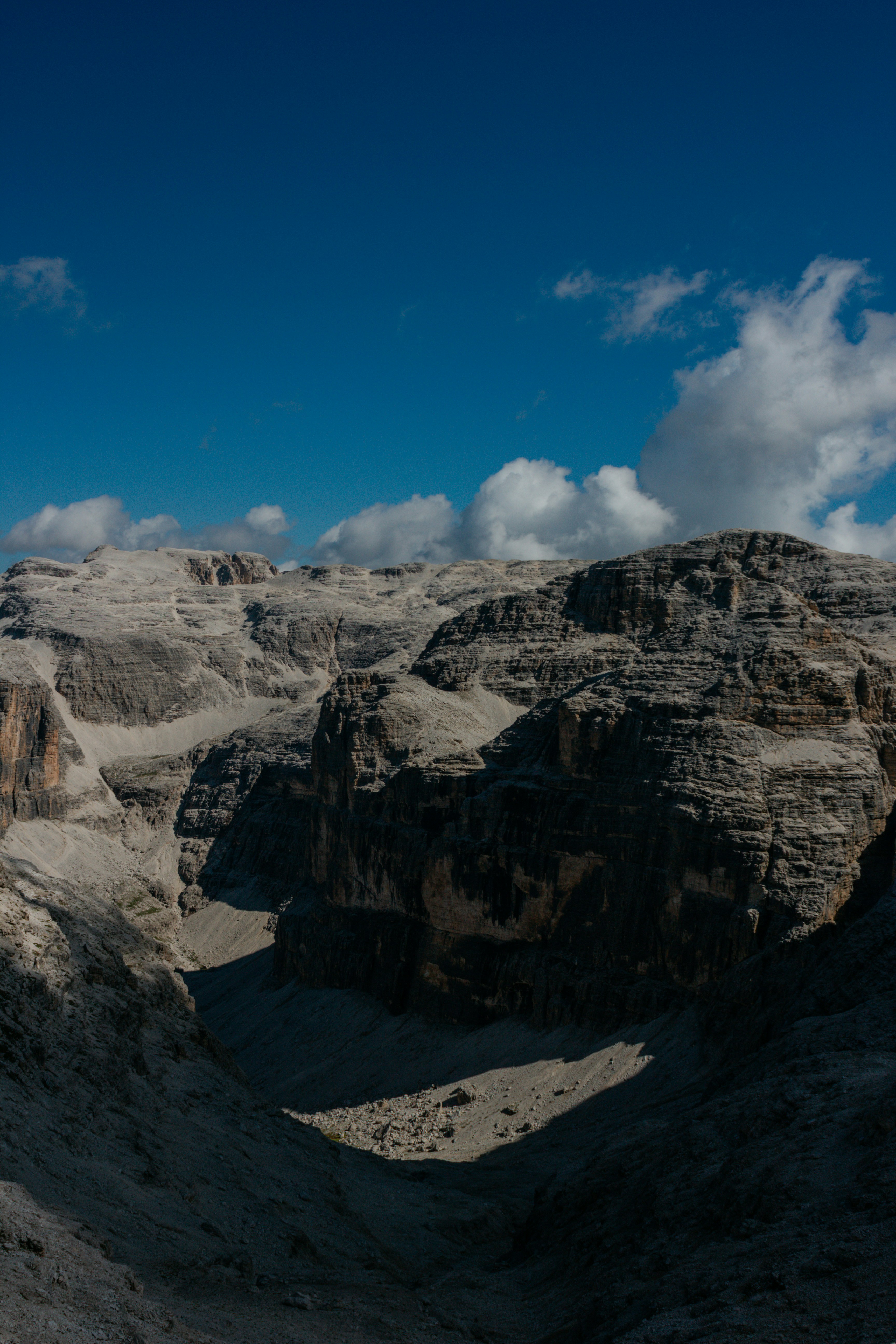 Desertine Abyss: Carved Cliffs Beneath a Clear Sky