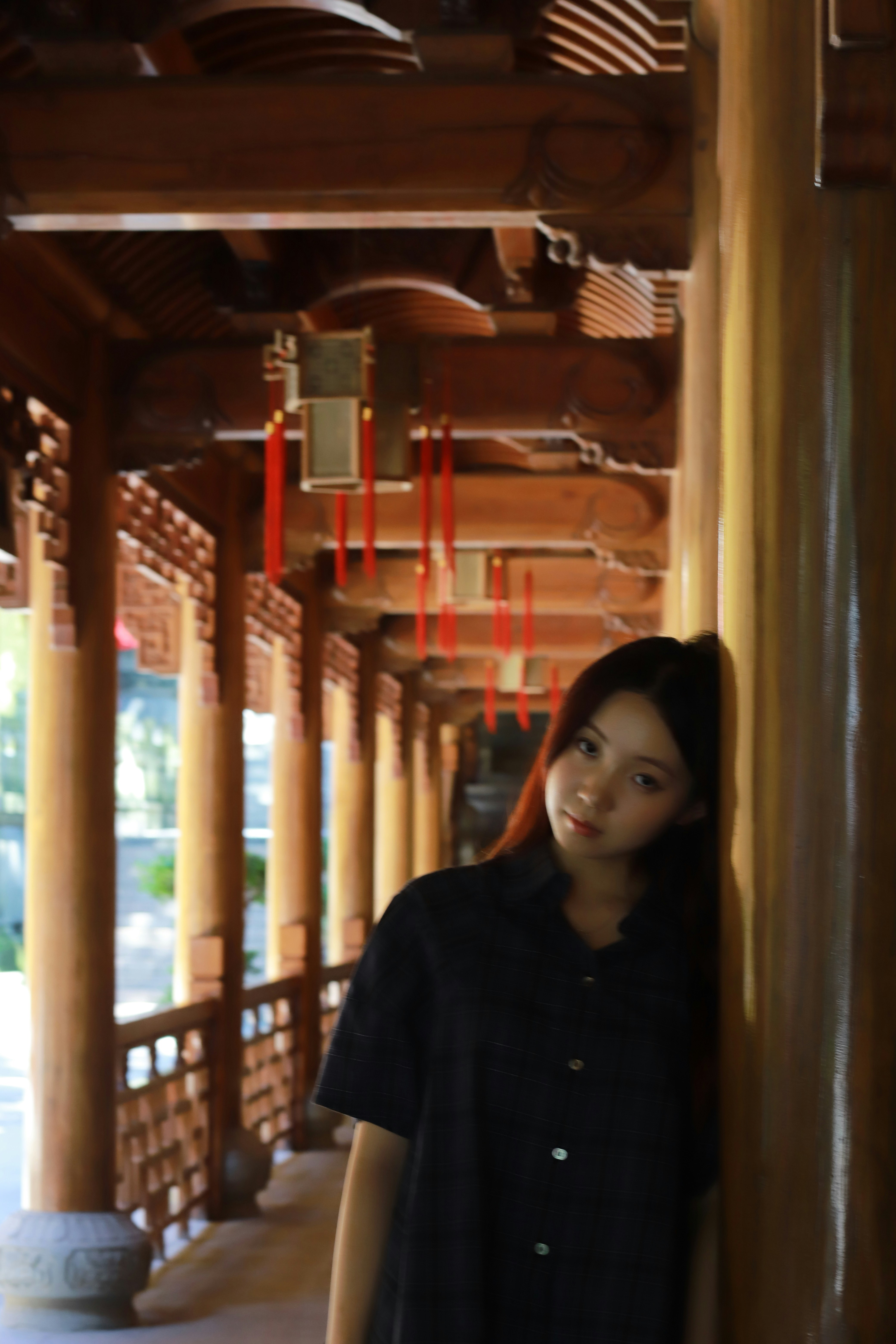 Portrait in a Wooden Corridor: Soft Light, Warm Lines