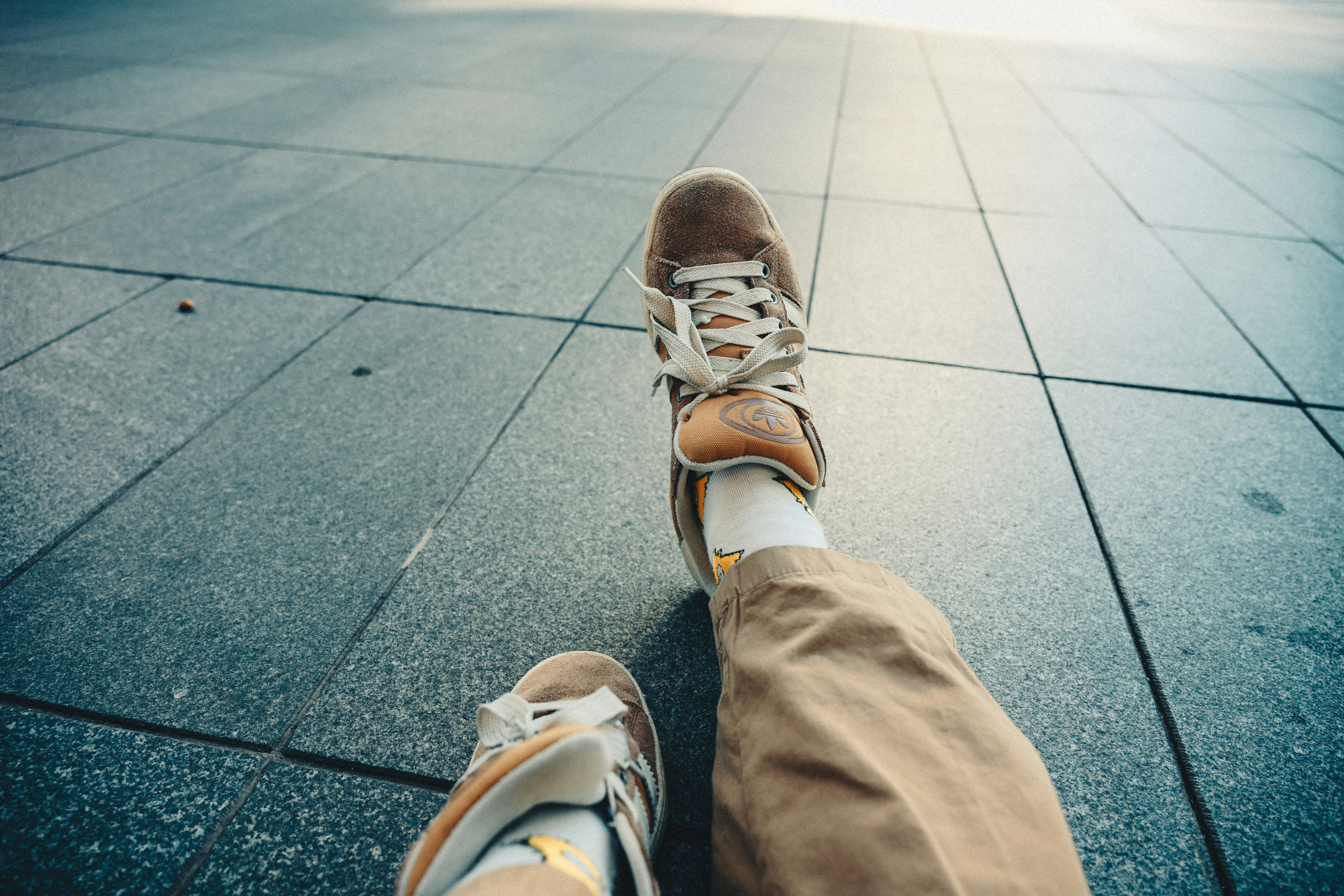 One Foot Forward: A Quiet Pause on the Tiled Ground