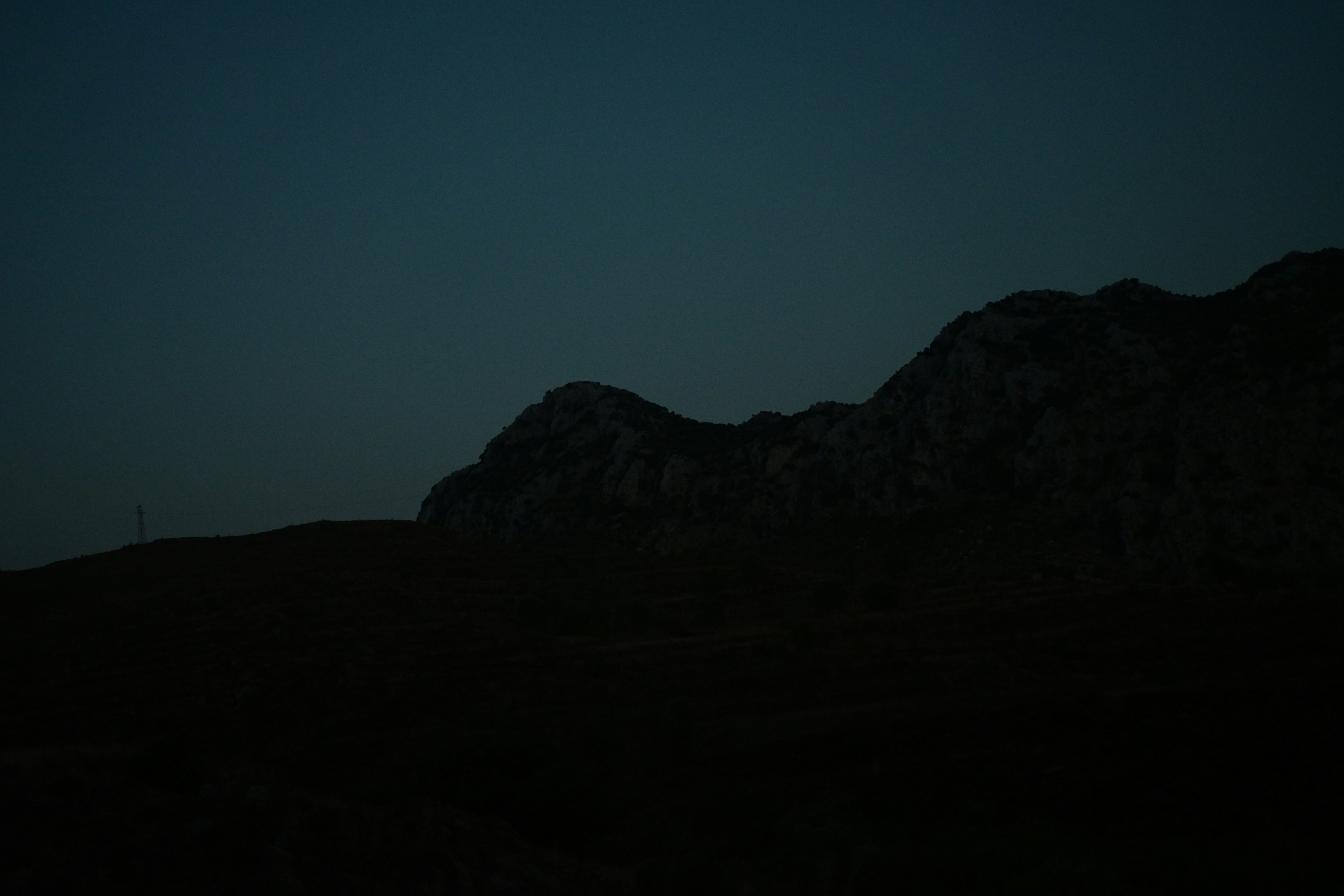 Dusk Silhouette Over Rugged Ridge