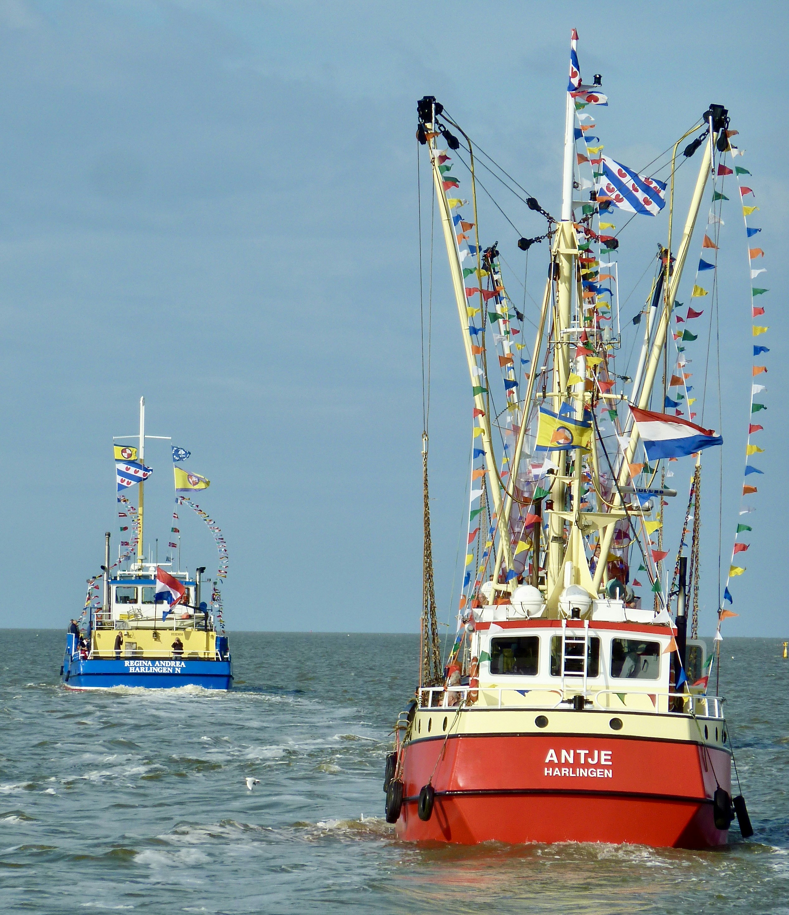 Red Rescue: A Lifeboat Parade Surges Toward the Horizon
