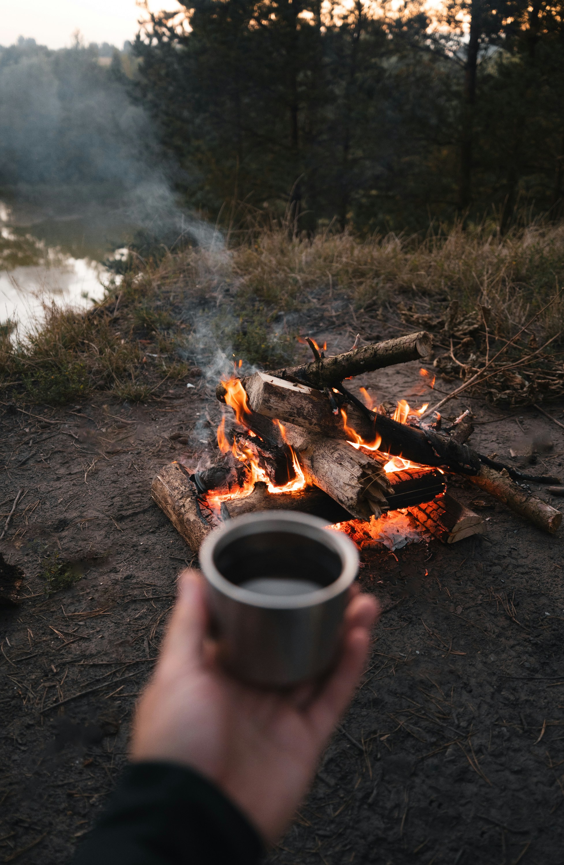 Cozy Campfire Toast: A Handful of Steam over Embered Logs