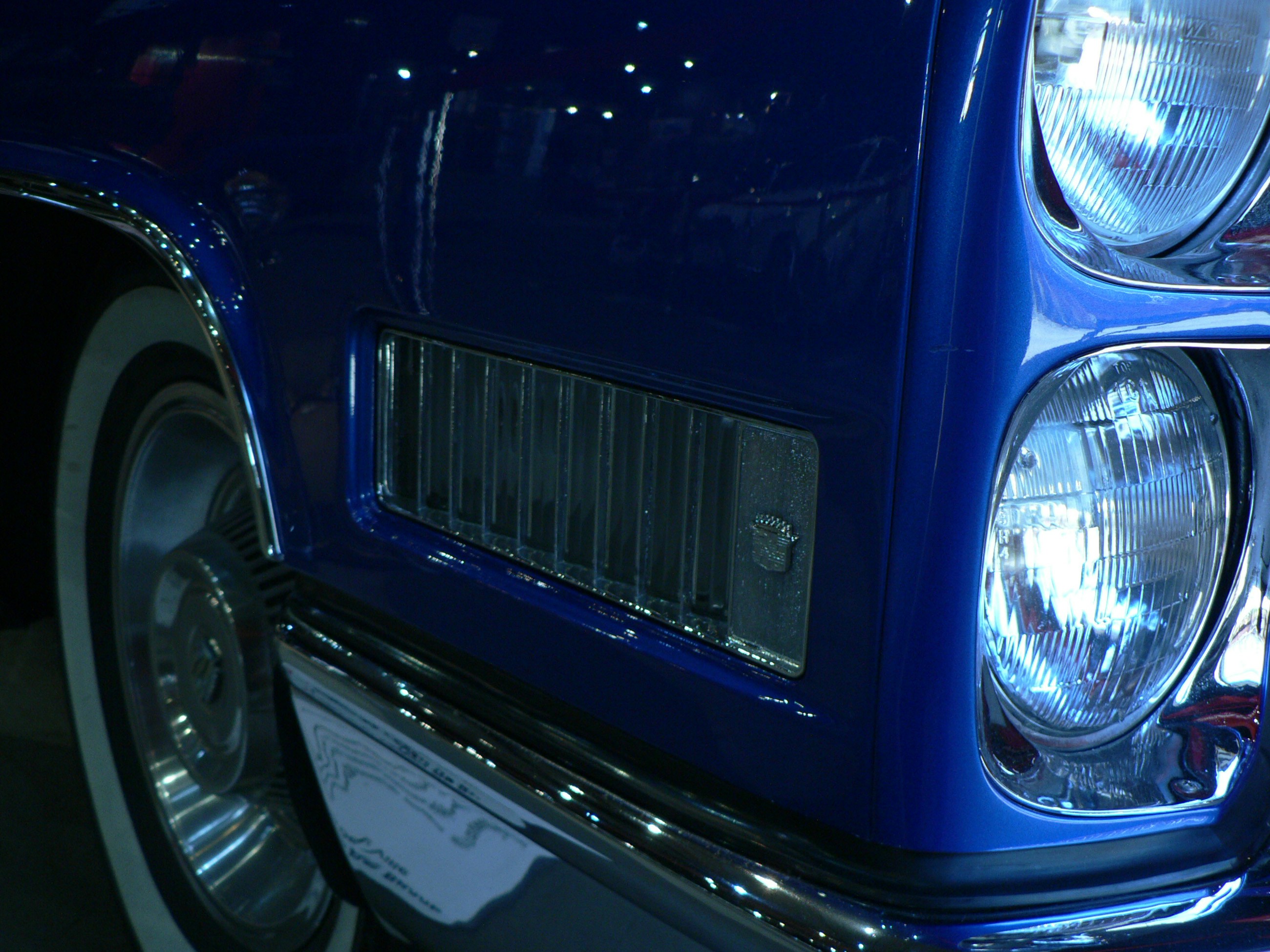 Chrome and cobalt: the blue machine’s gleam by the headlight