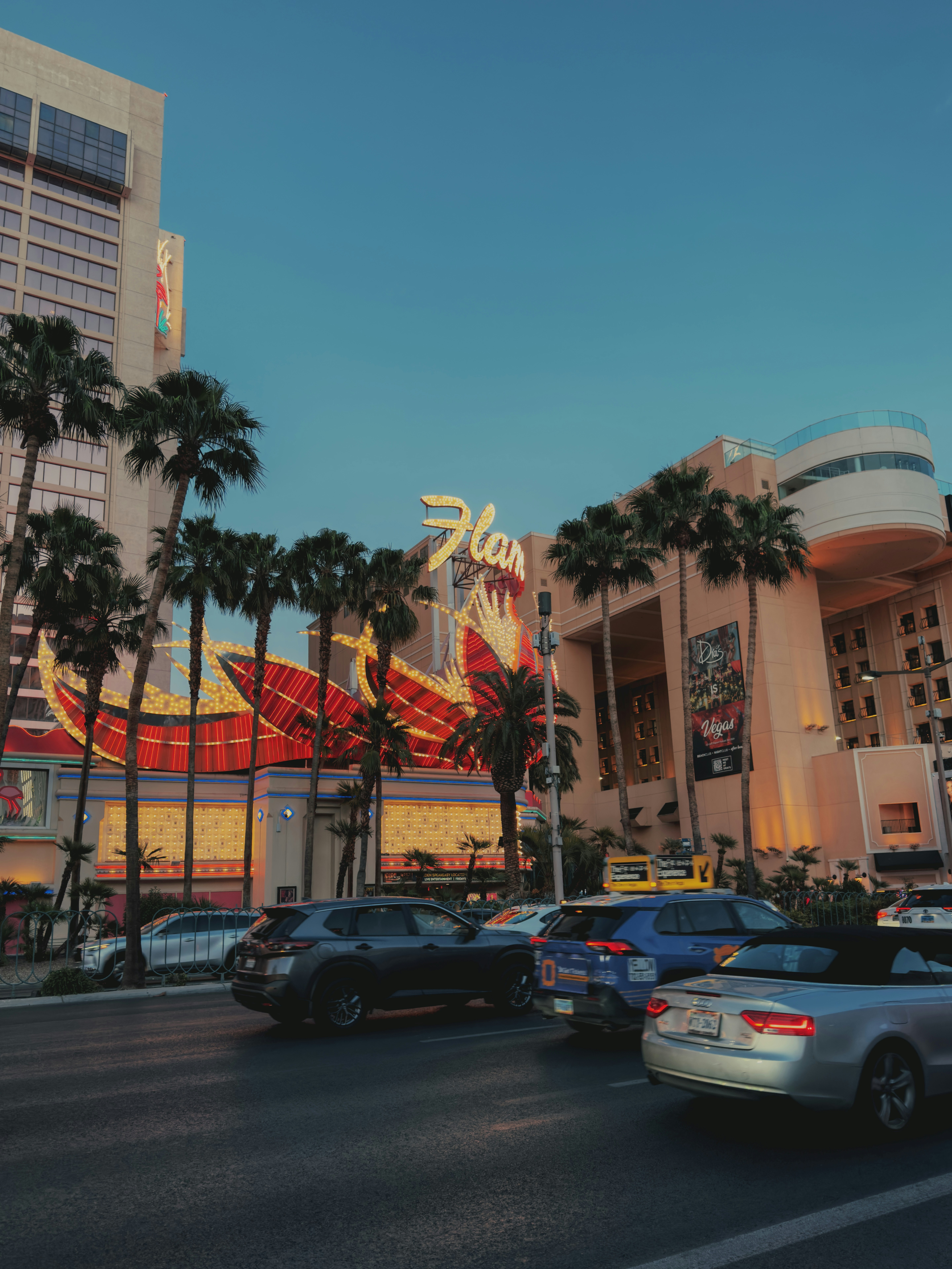 Neon Mirage on the Strip: Sunlit Cars and Palm Shadows