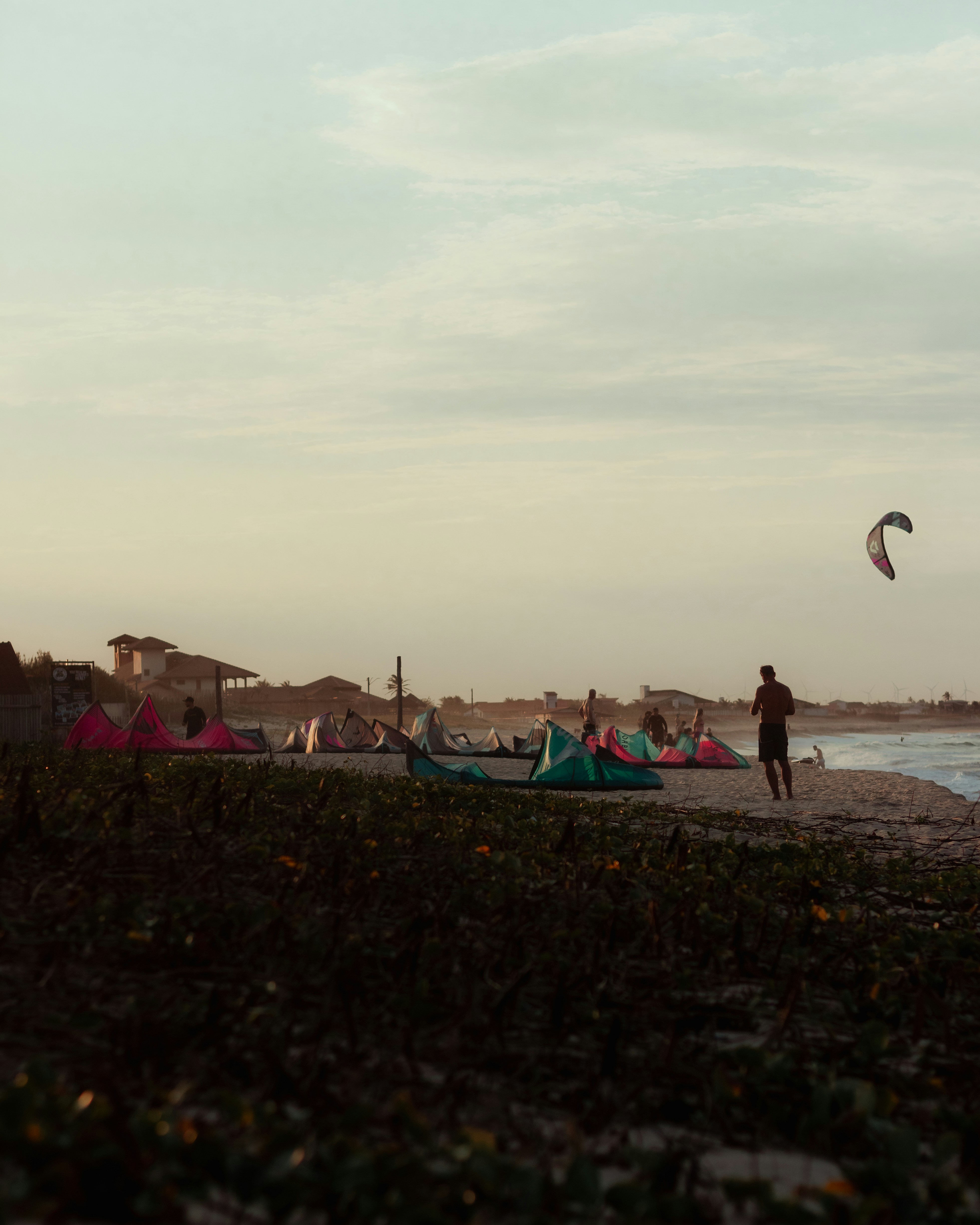 Kite Surfer Silhouette at Dusk: A Quiet Beach Scene