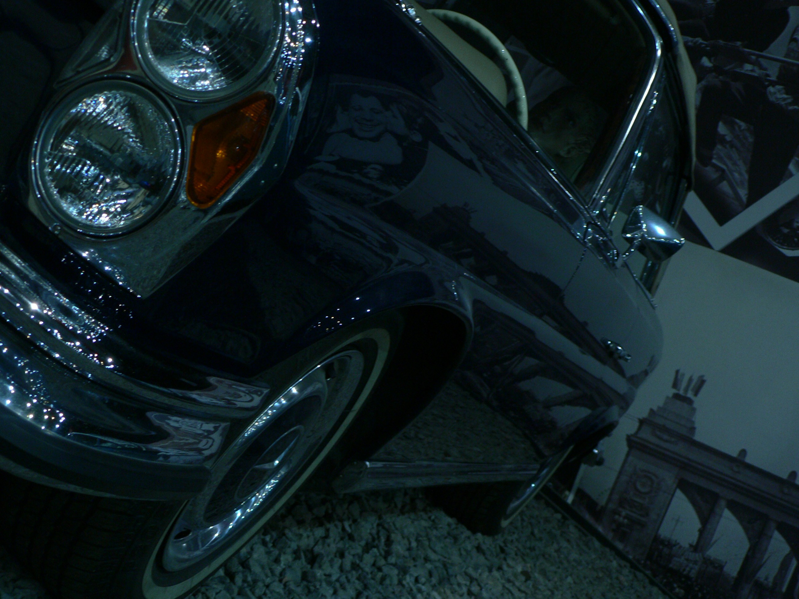 Chrome Moonlit Classic: A Vintage Car in an Indoor Gallery