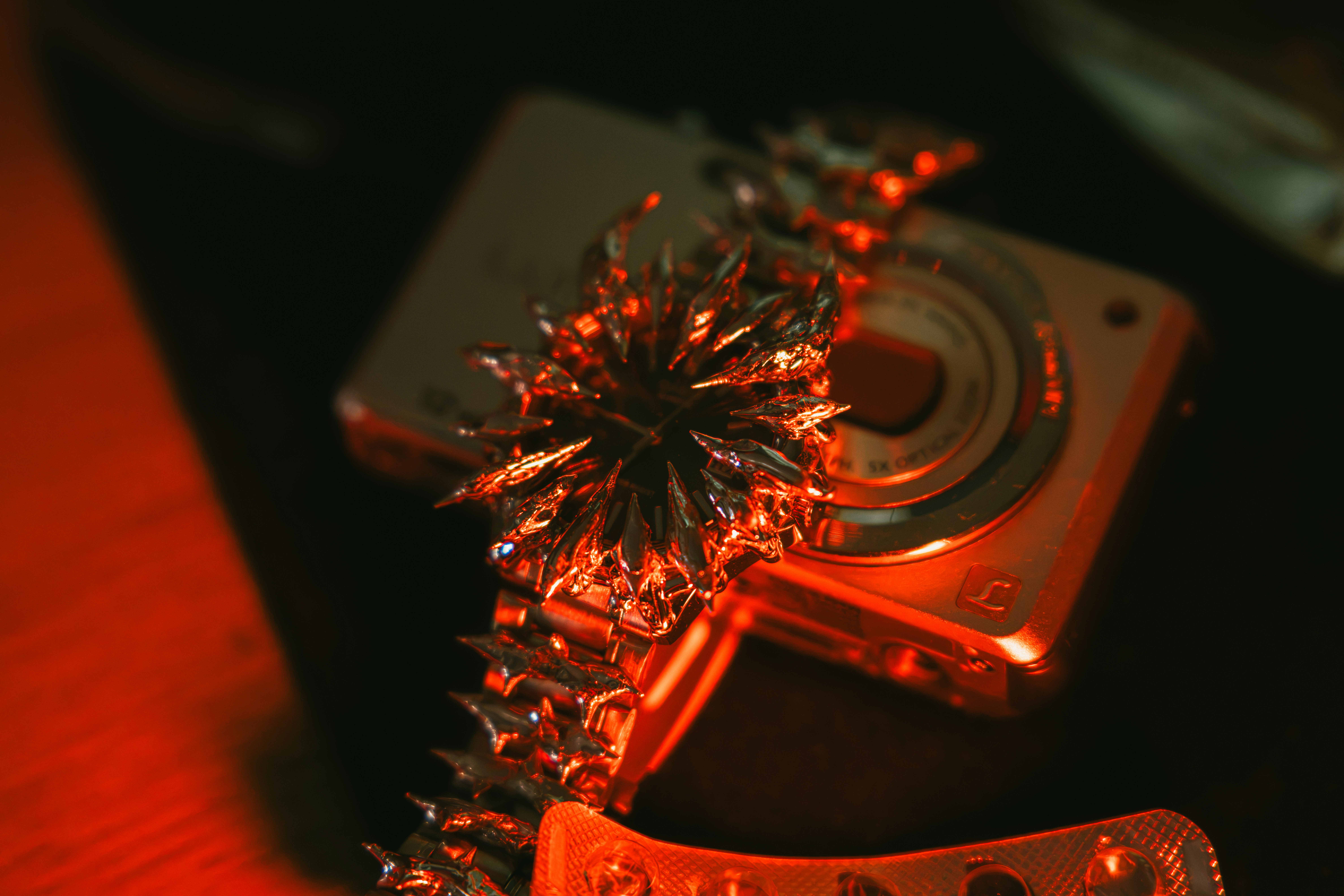 Crimson Glint: A Shattered Probe on a Retro Lens