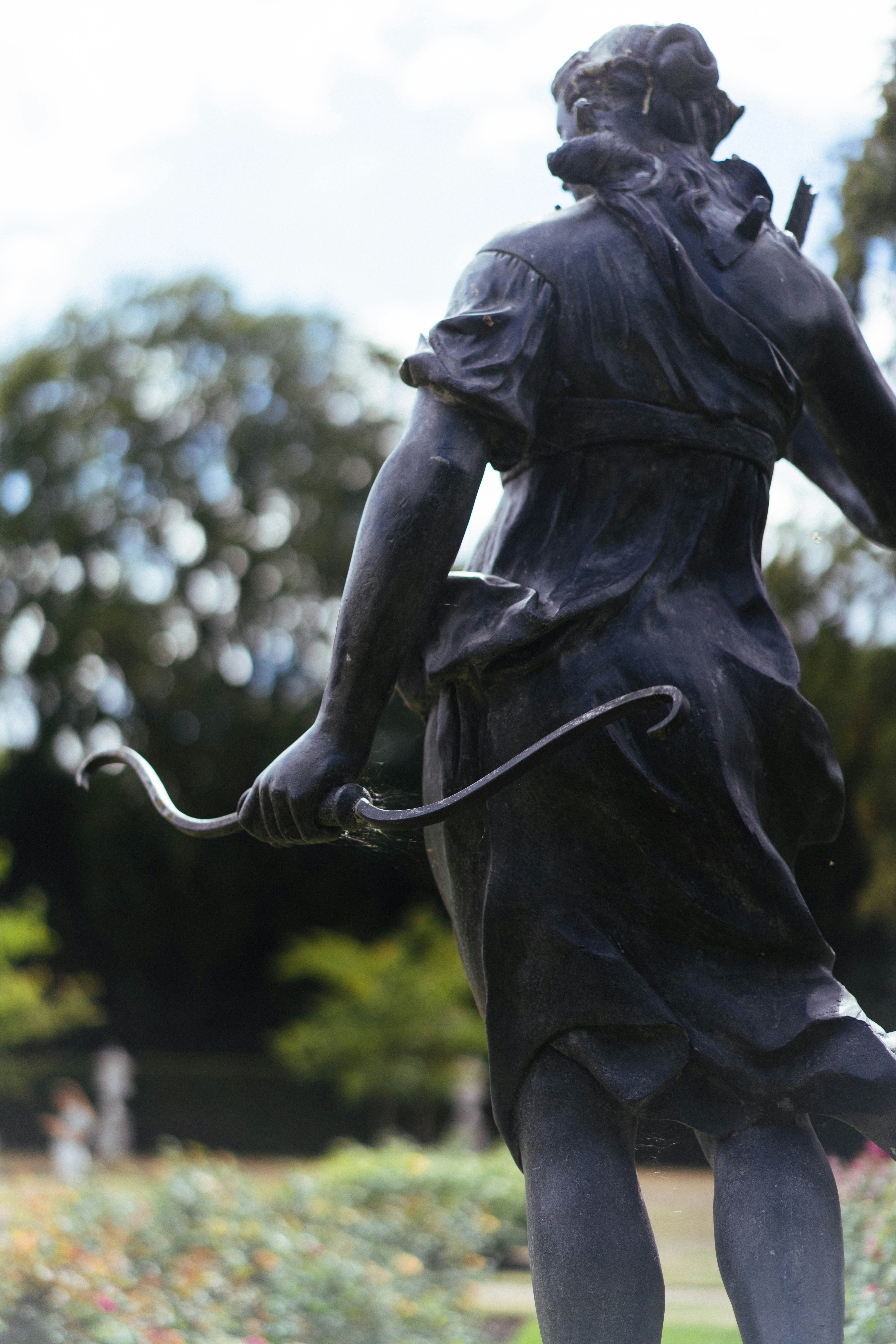 Bronze Archer in Motion: A Grain of Night in the Garden