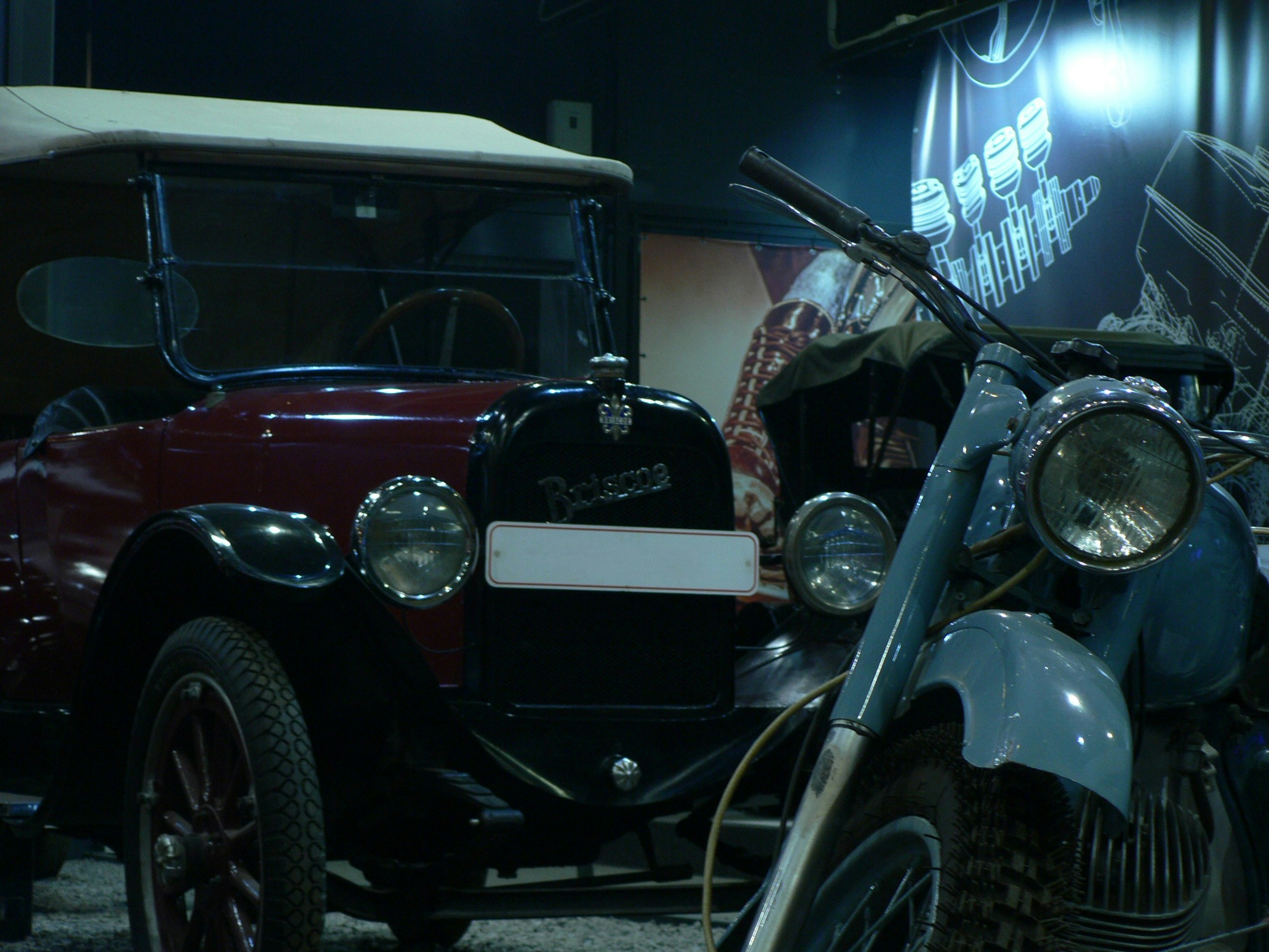 Vintage Duo in a Dim Motorworks Gallery