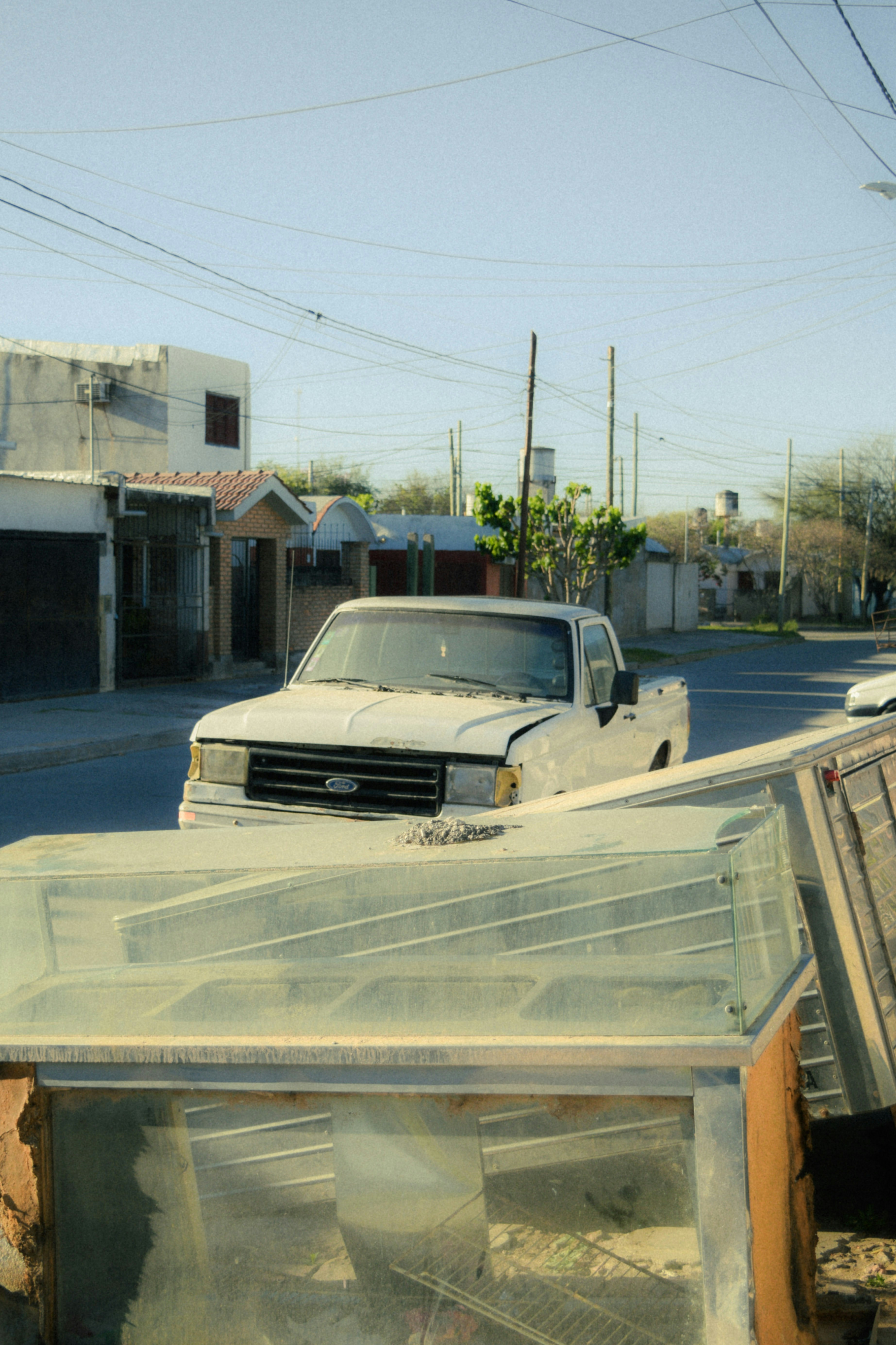 Dusty Street Runabout Under a Late-Afternoon Sky