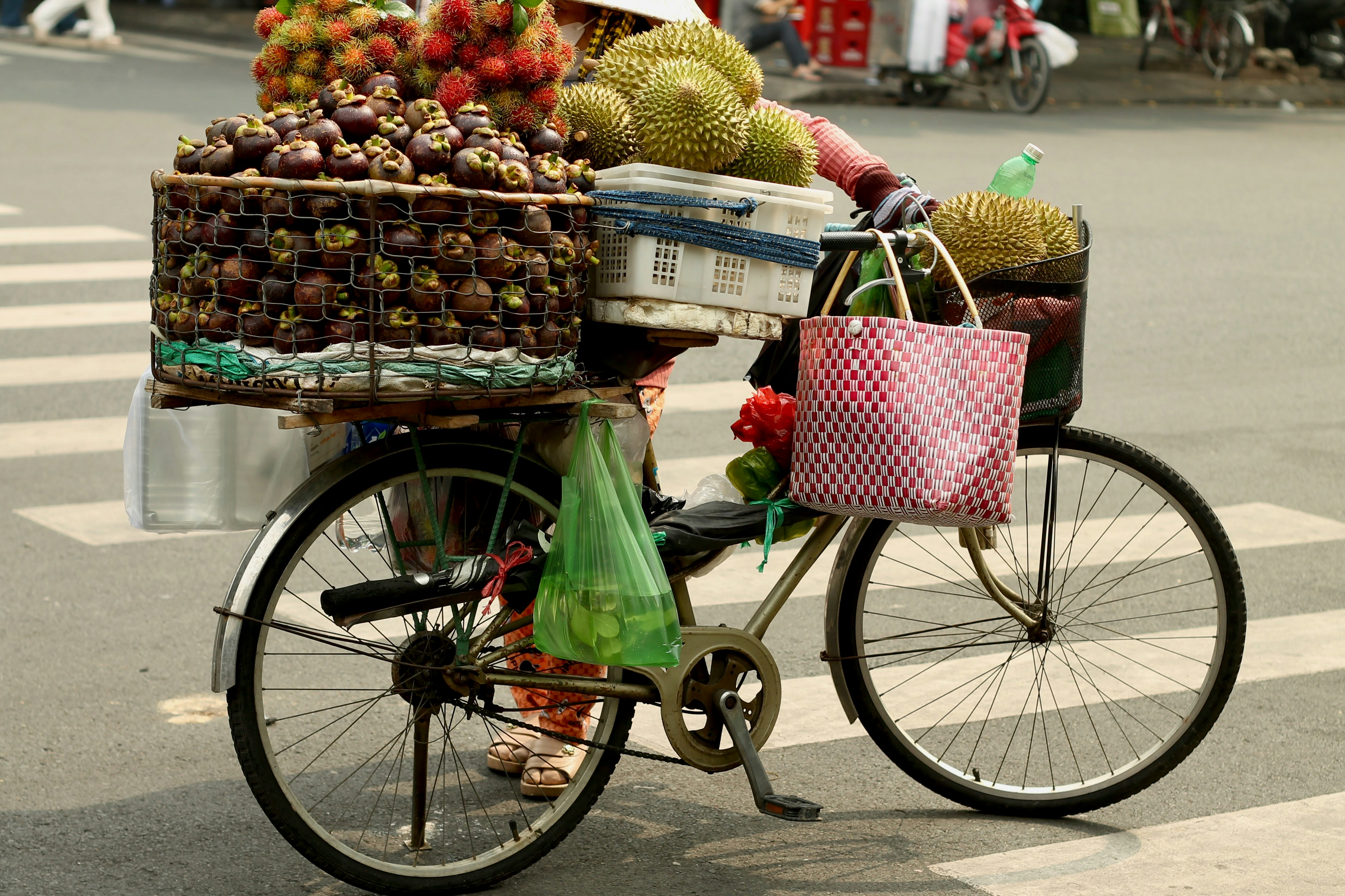 Fruit Cart on a Bicycle: Street Vendor at a Crossroad