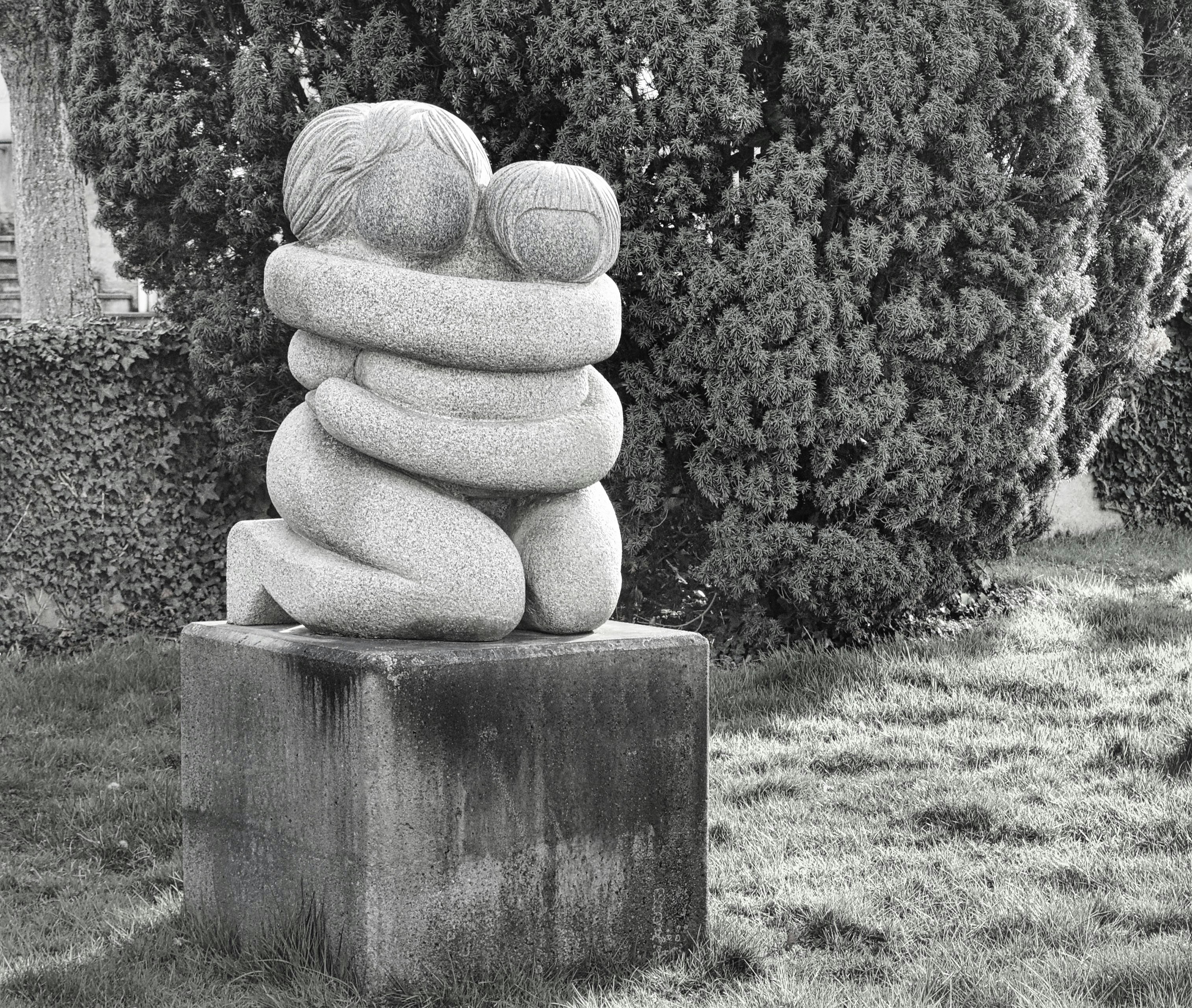 Stacked Embrace: A Stone Sculpture in Quiet Garden