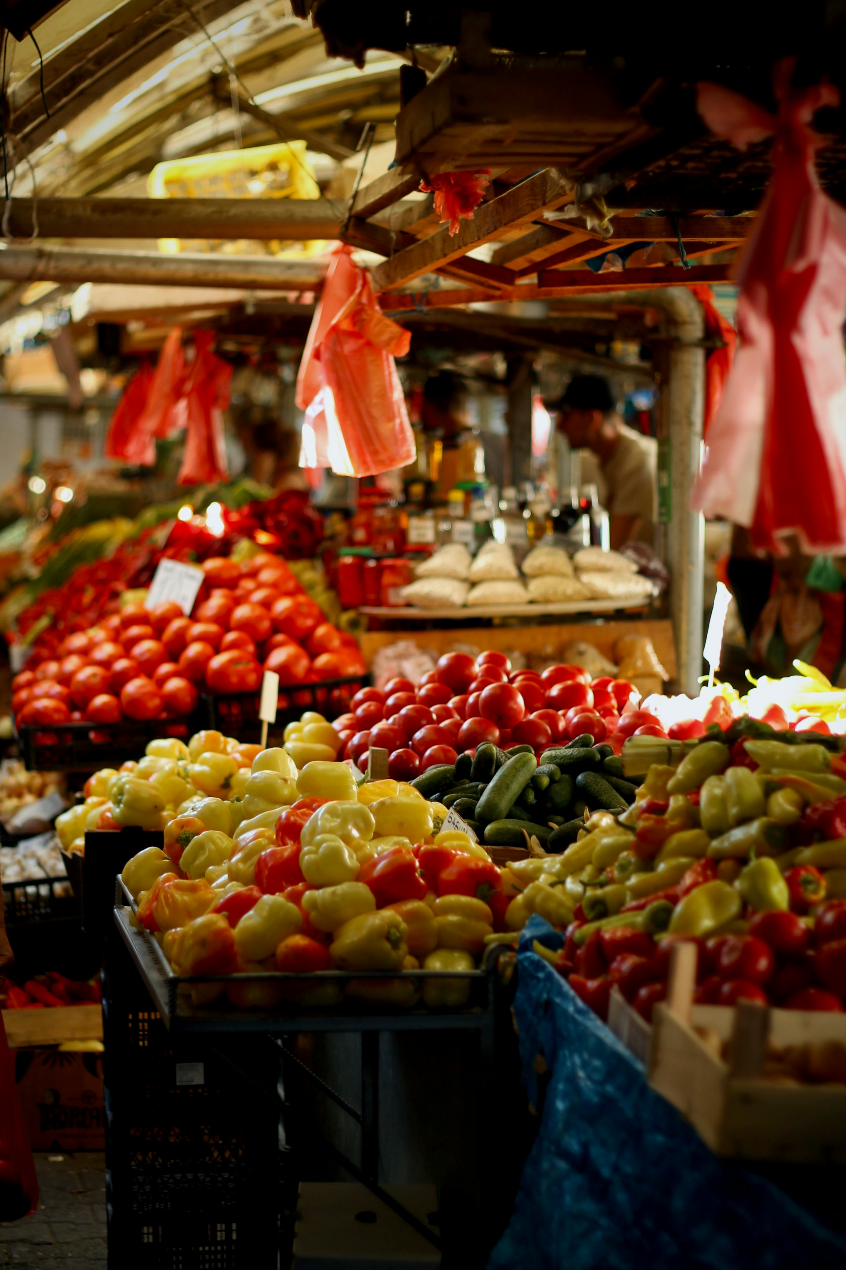 Vibrant Market Bounty under Warm Canopy