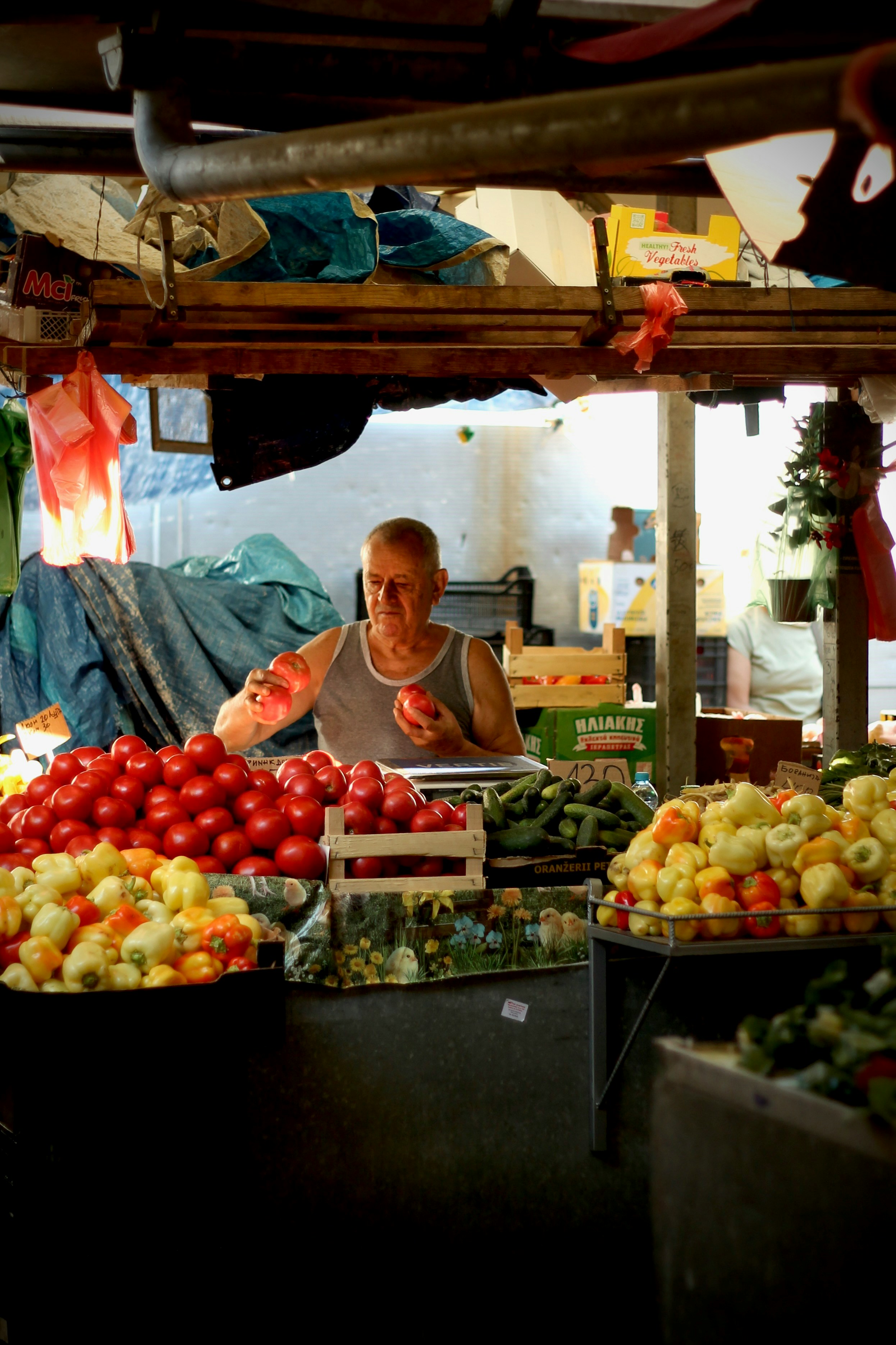 Market Vendor Transfix: Hands Full of Red Tomatoes