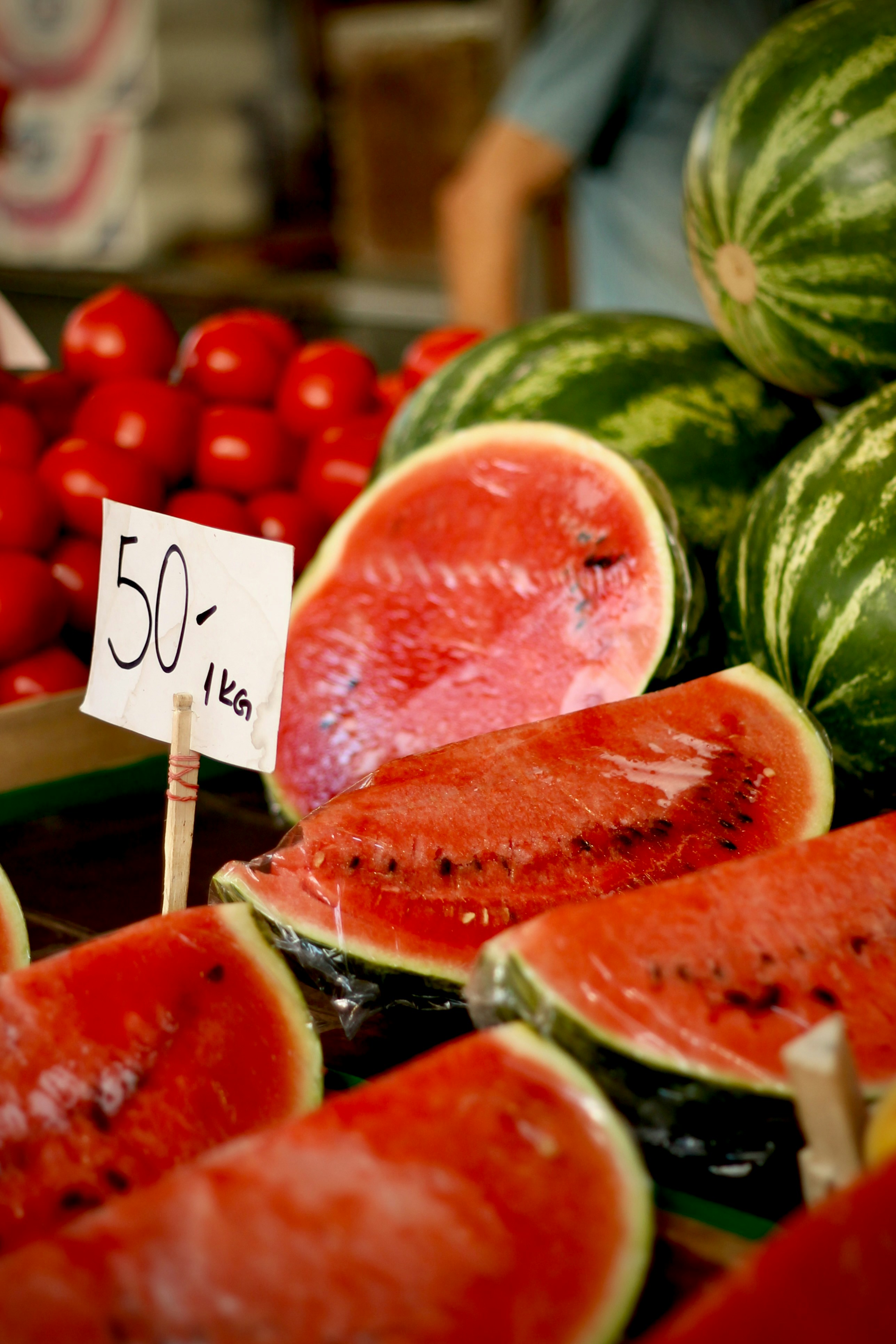 Watermelon Window at a Market: Juicy Red Slices and Fresh Signage