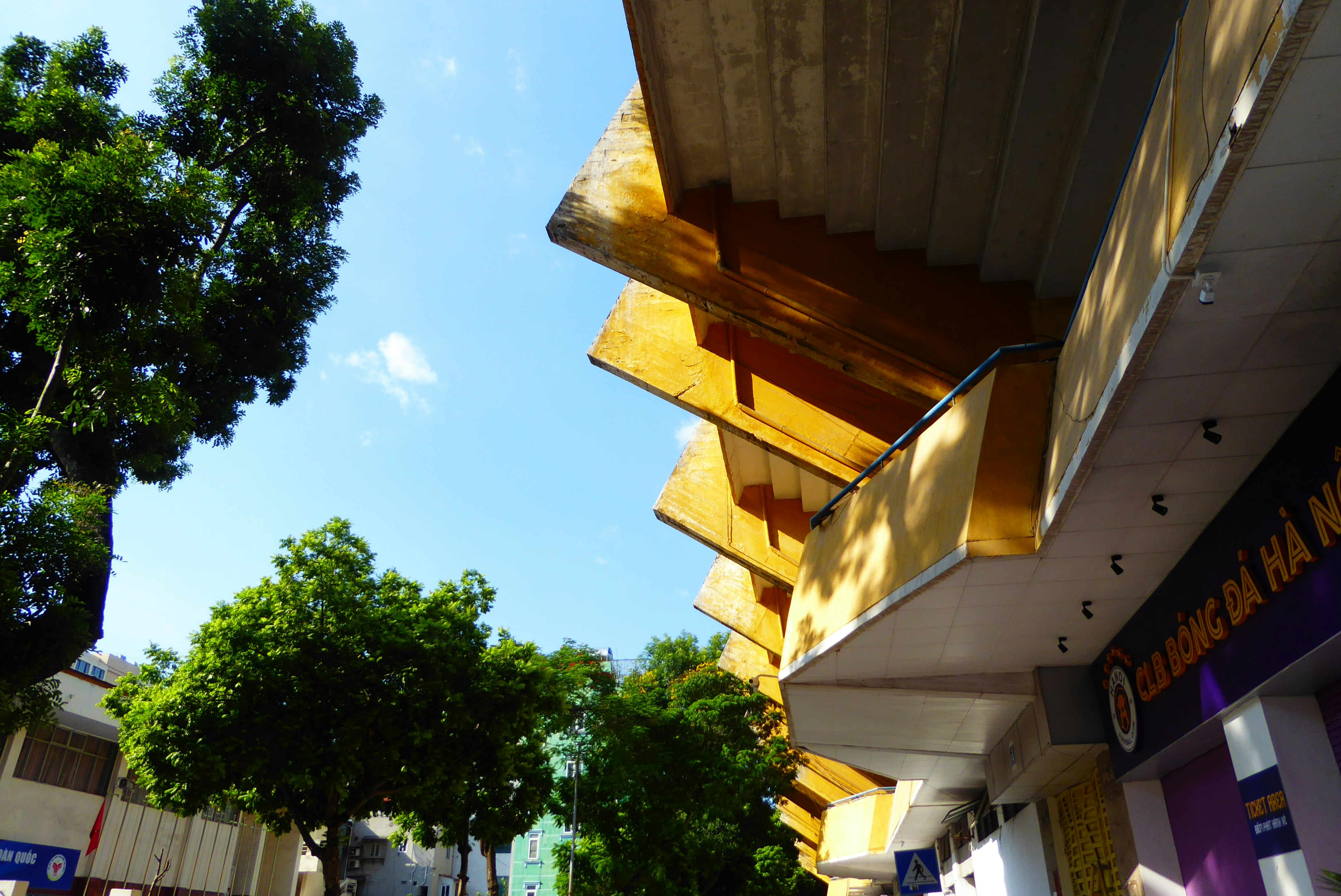 Golden Overhangs: Architectural Angles in Sunlit Facade