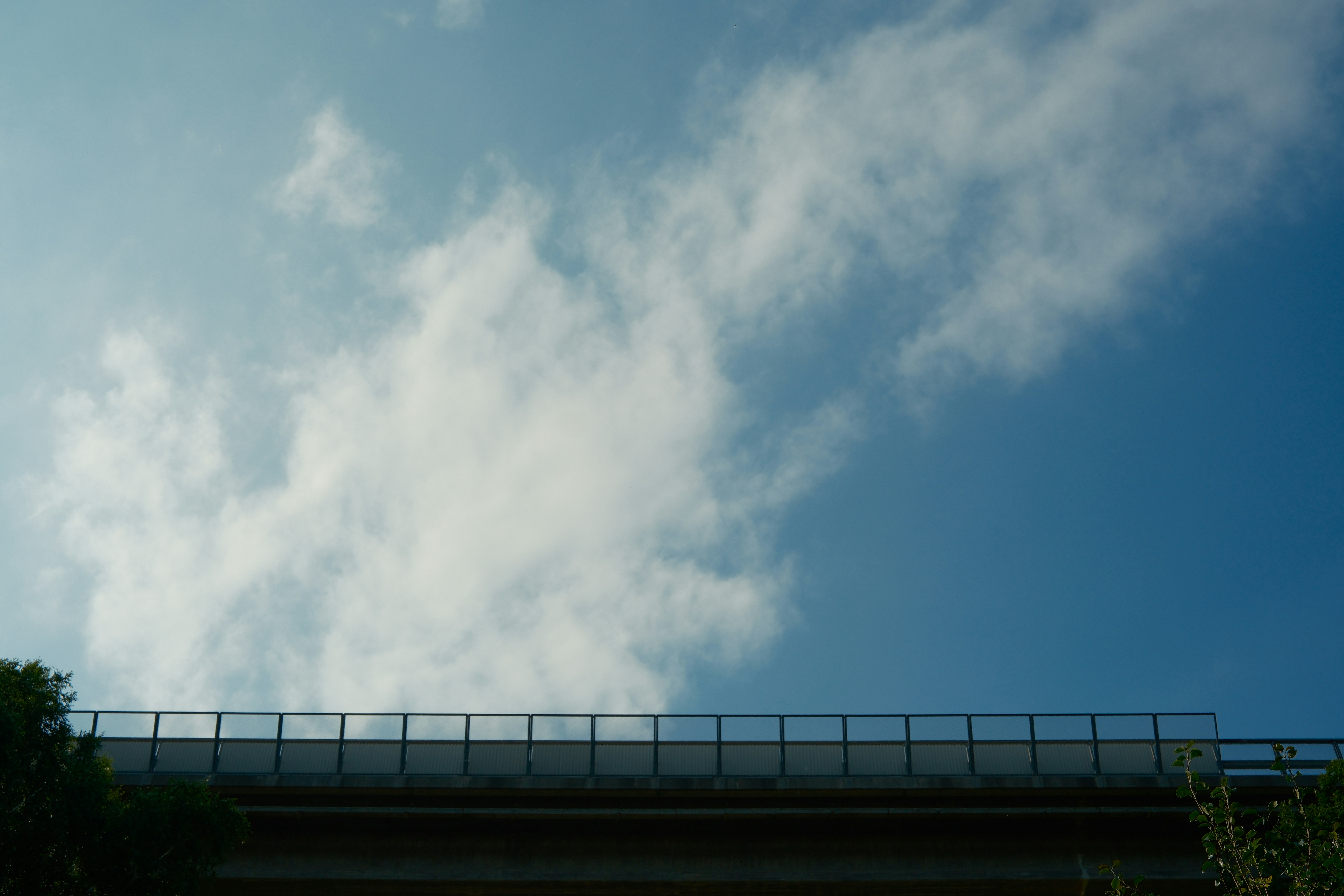 Above the Rails: Skyward Span Over a Quiet Overpass