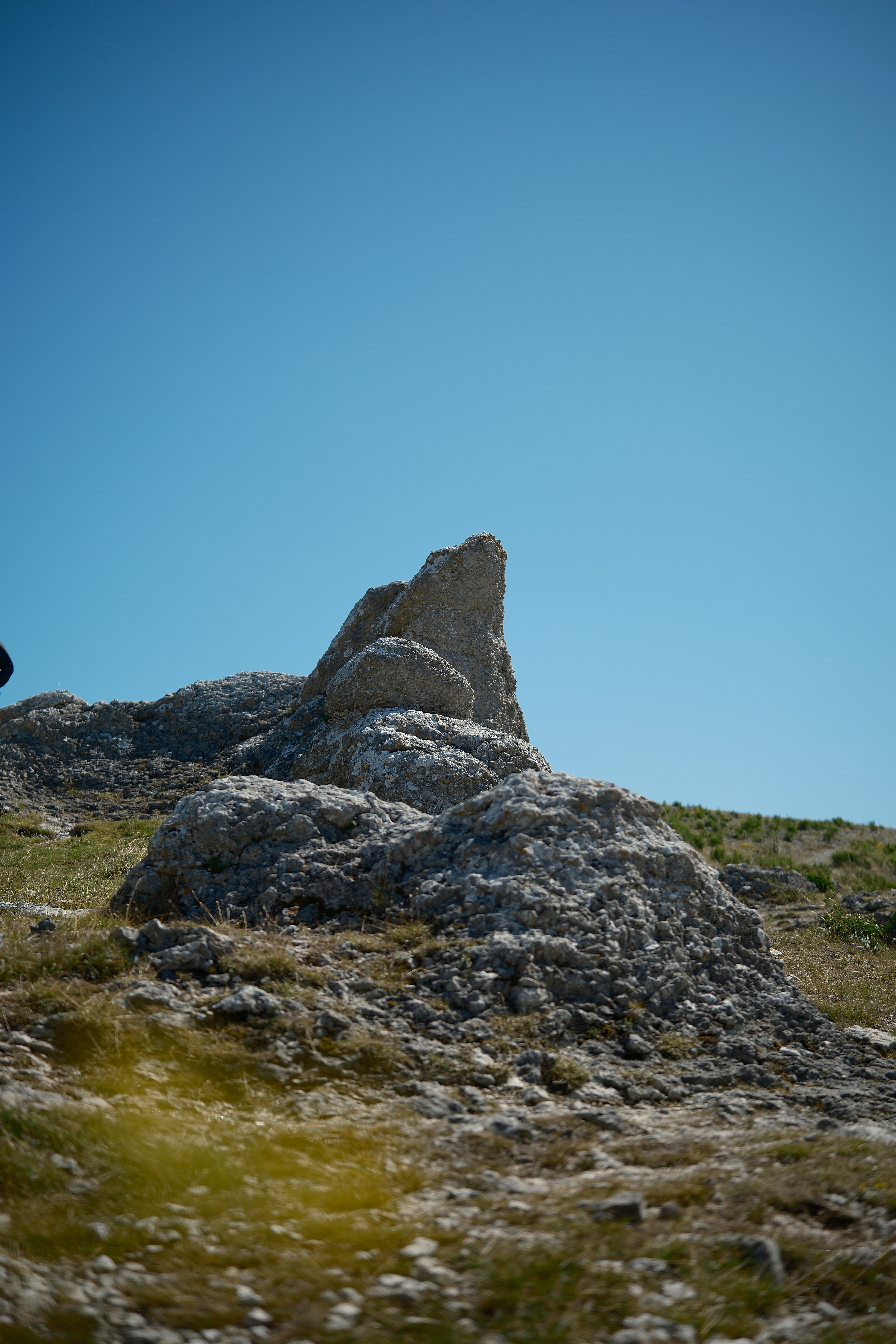 Stone Sentinel Against a Clear Coastal Sky