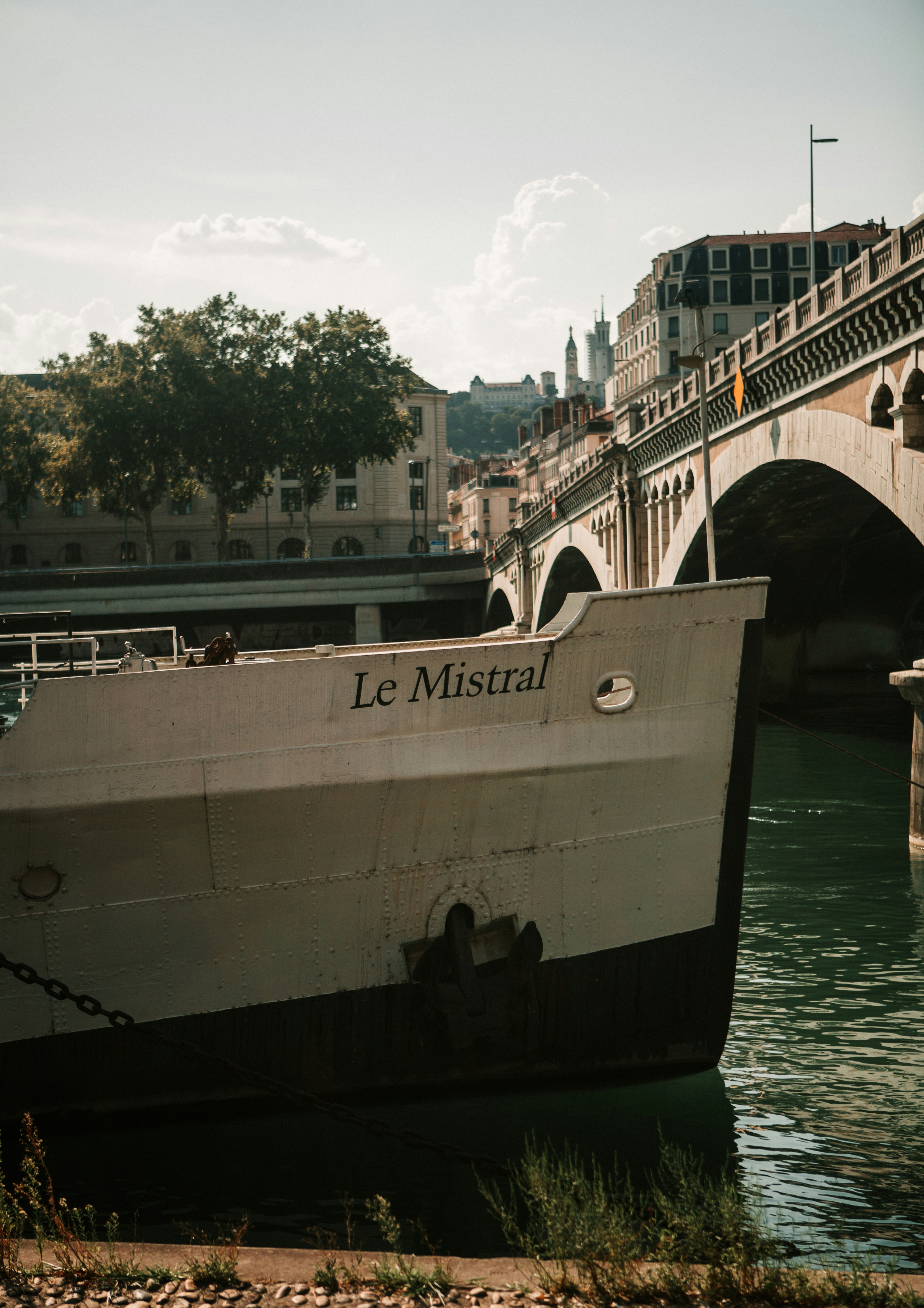 Le Mistral at Dusk: A Parisian River Moment by the Footbridge