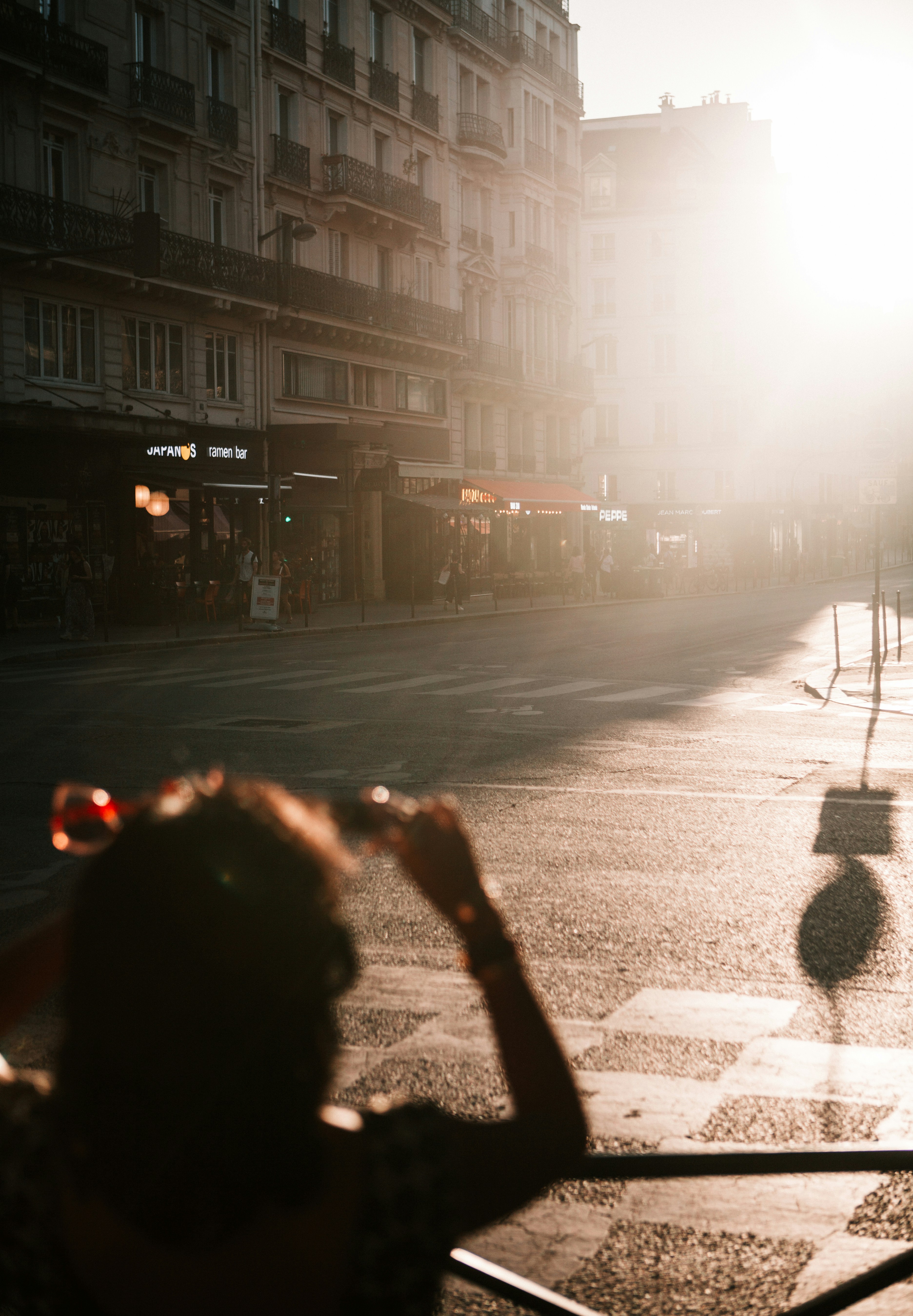 Sunlit Street Reverie: A Quiet Moment at the Corner