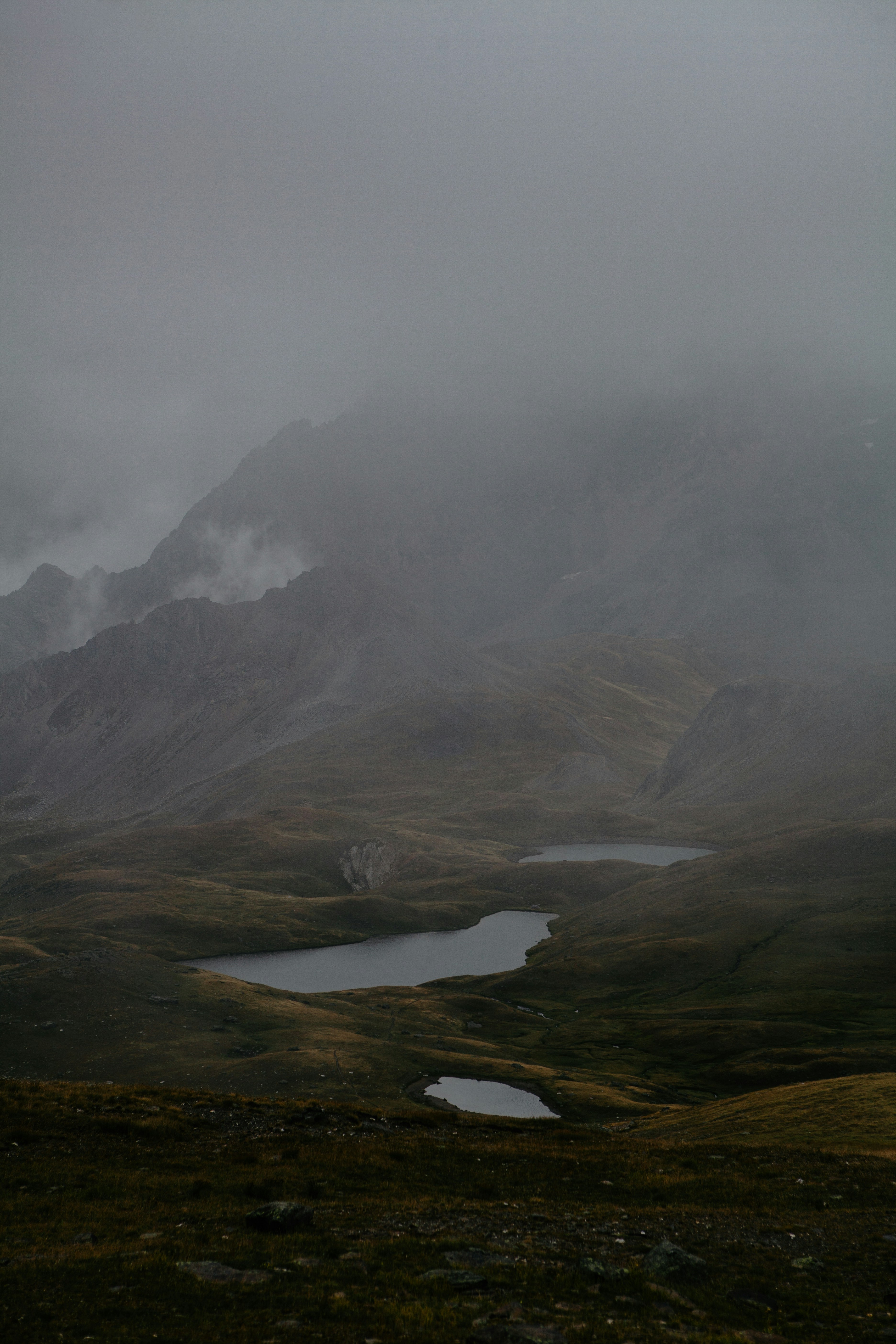 Mist-Lost valley: hidden lakes beneath clouded peaks