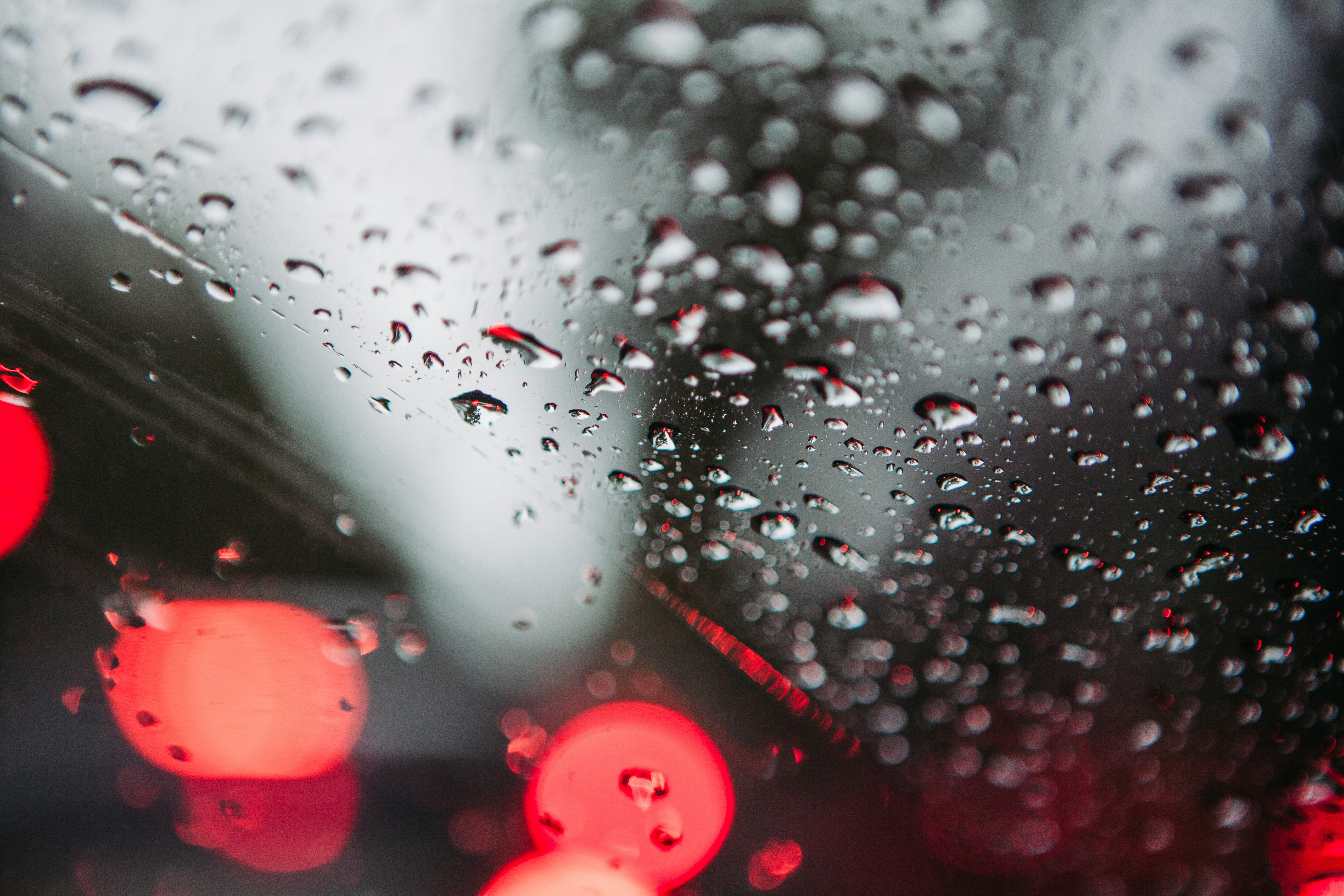 Blurred City Lights Through Rain-Streaked Glass
