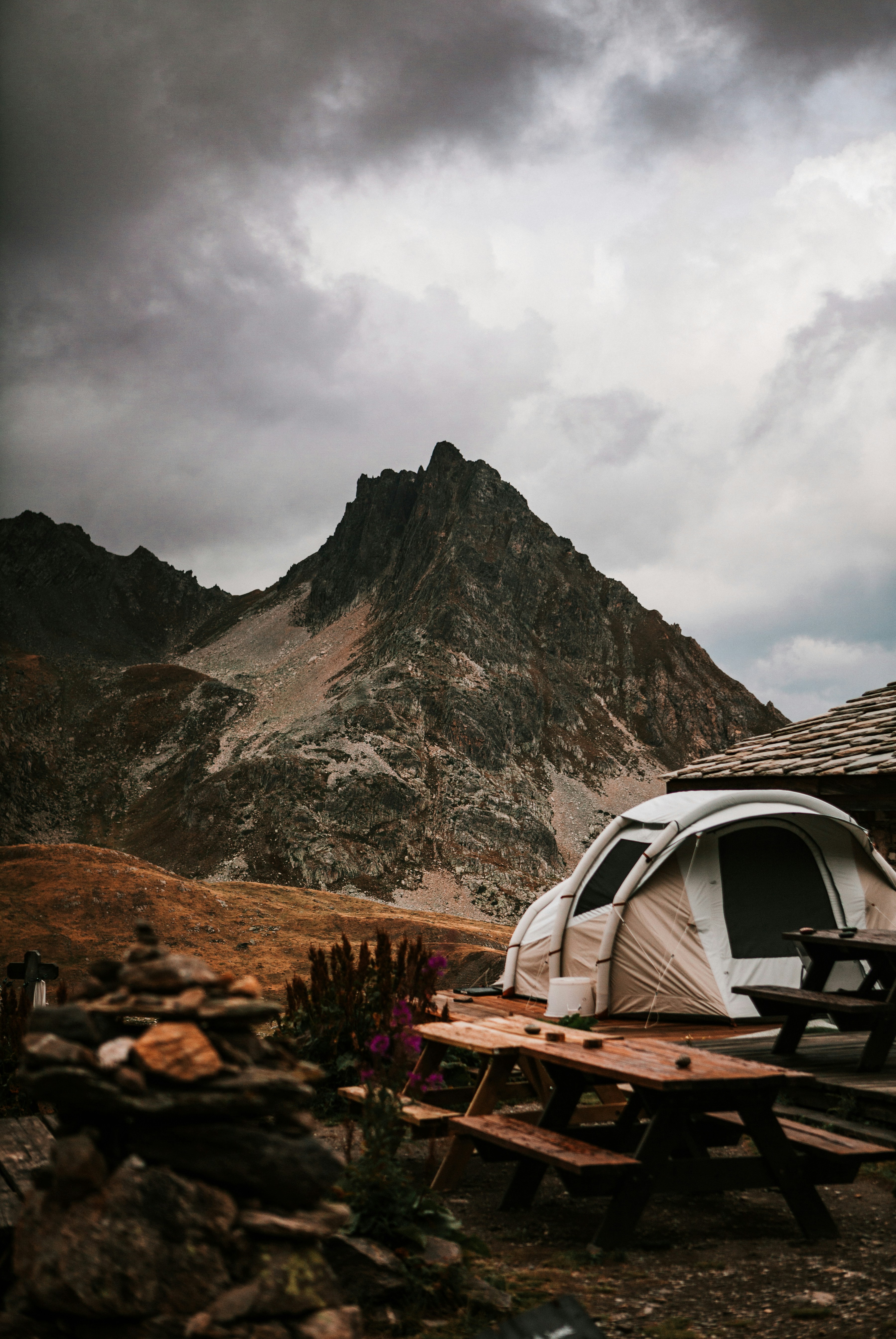 Campfire Terrace Beneath a Jagged Peak