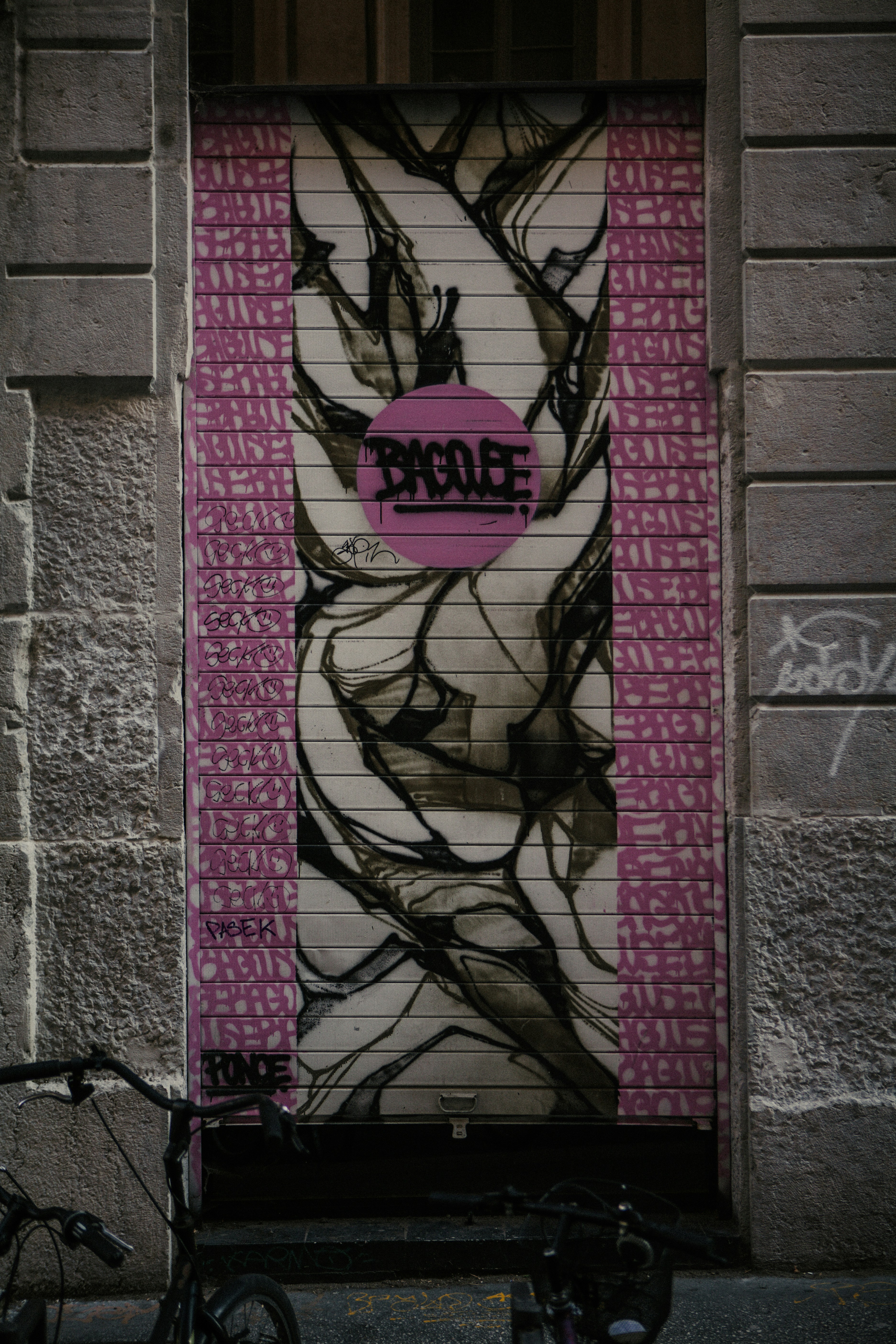 Circle of Tan Lines: Hands Framing a Pink Orb on an Urban Door
