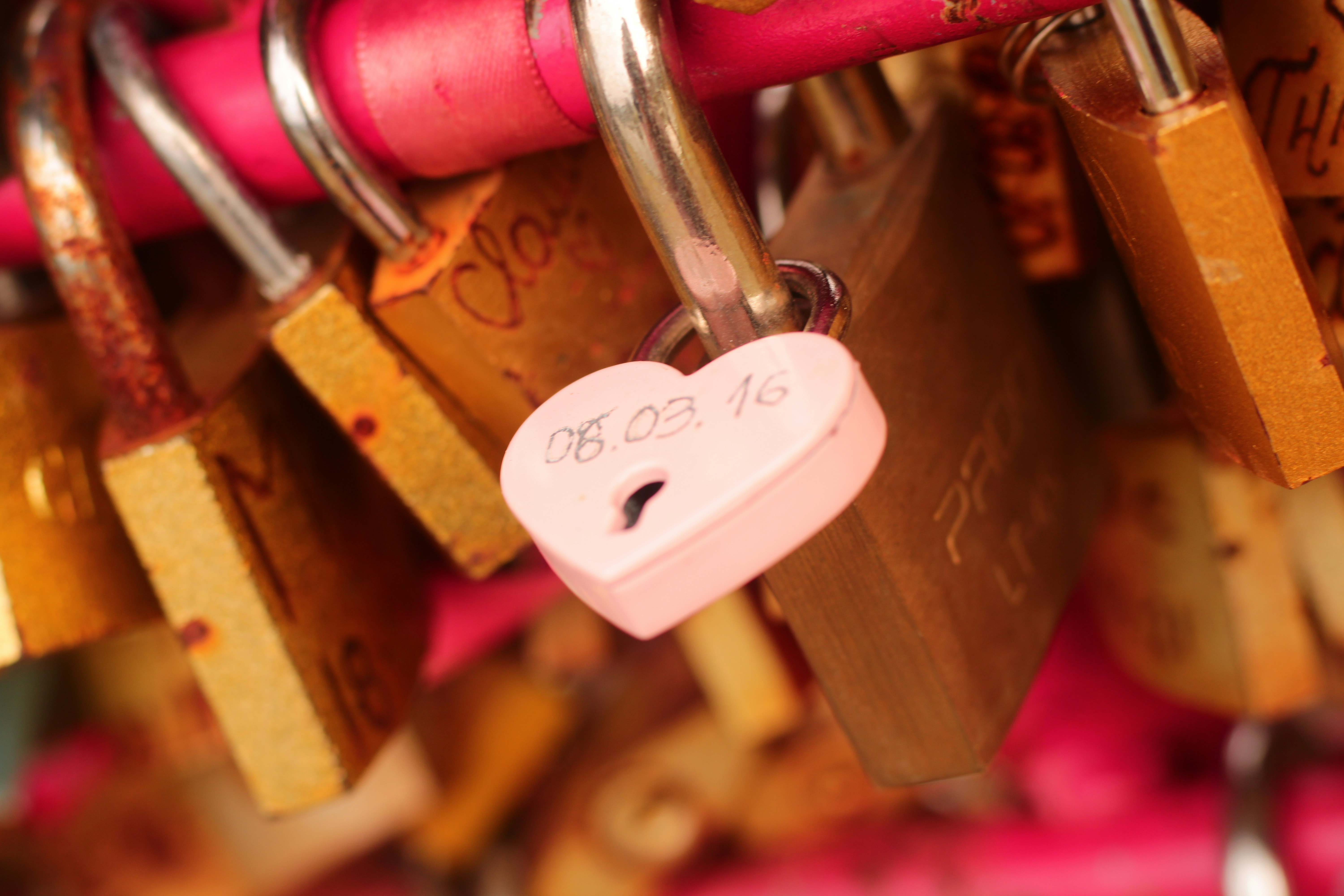 Padlocks of Promise: A Close-Up of Love Locks on a Railing