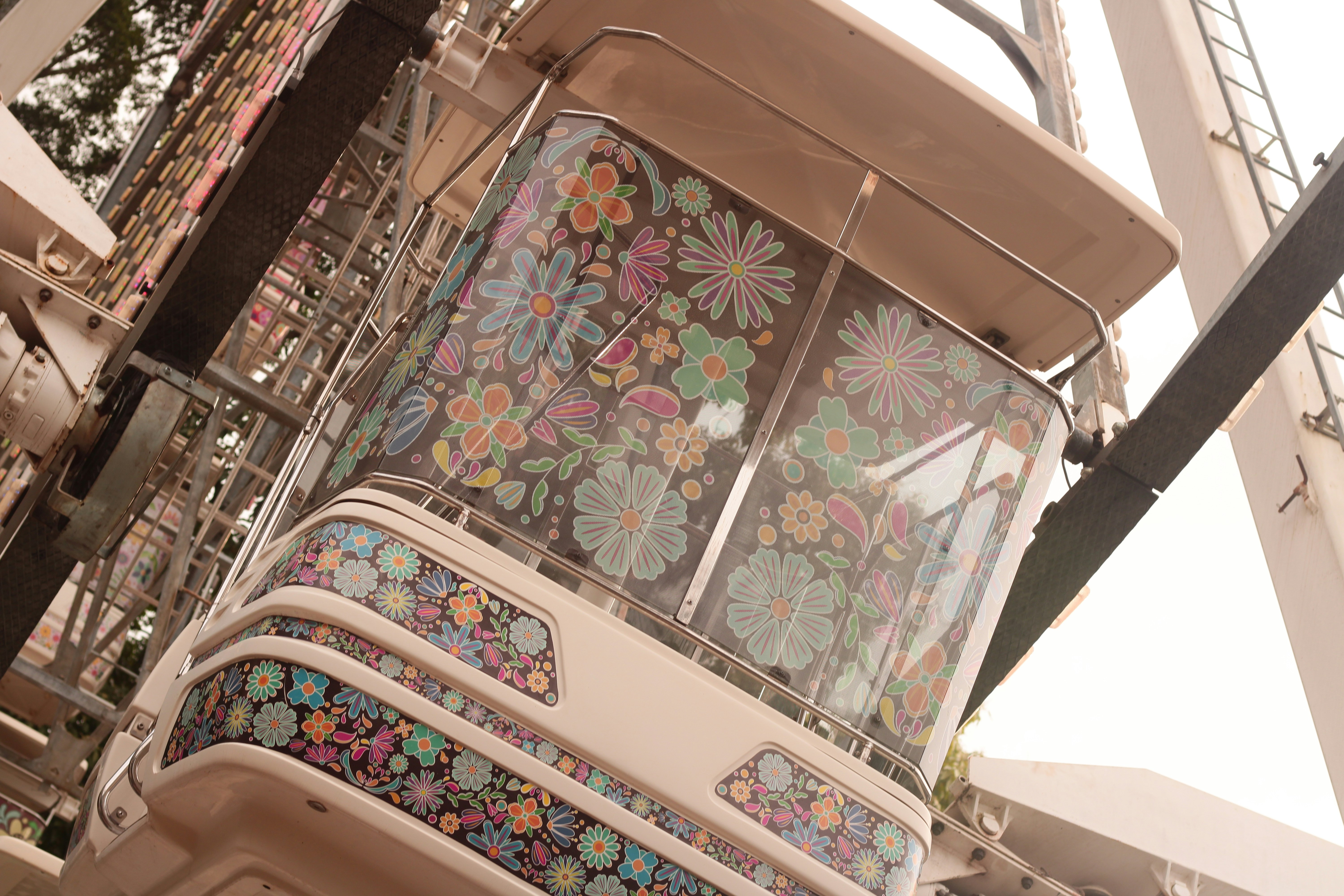 Floral Carousel: A Vintage Ride Amid City Light
