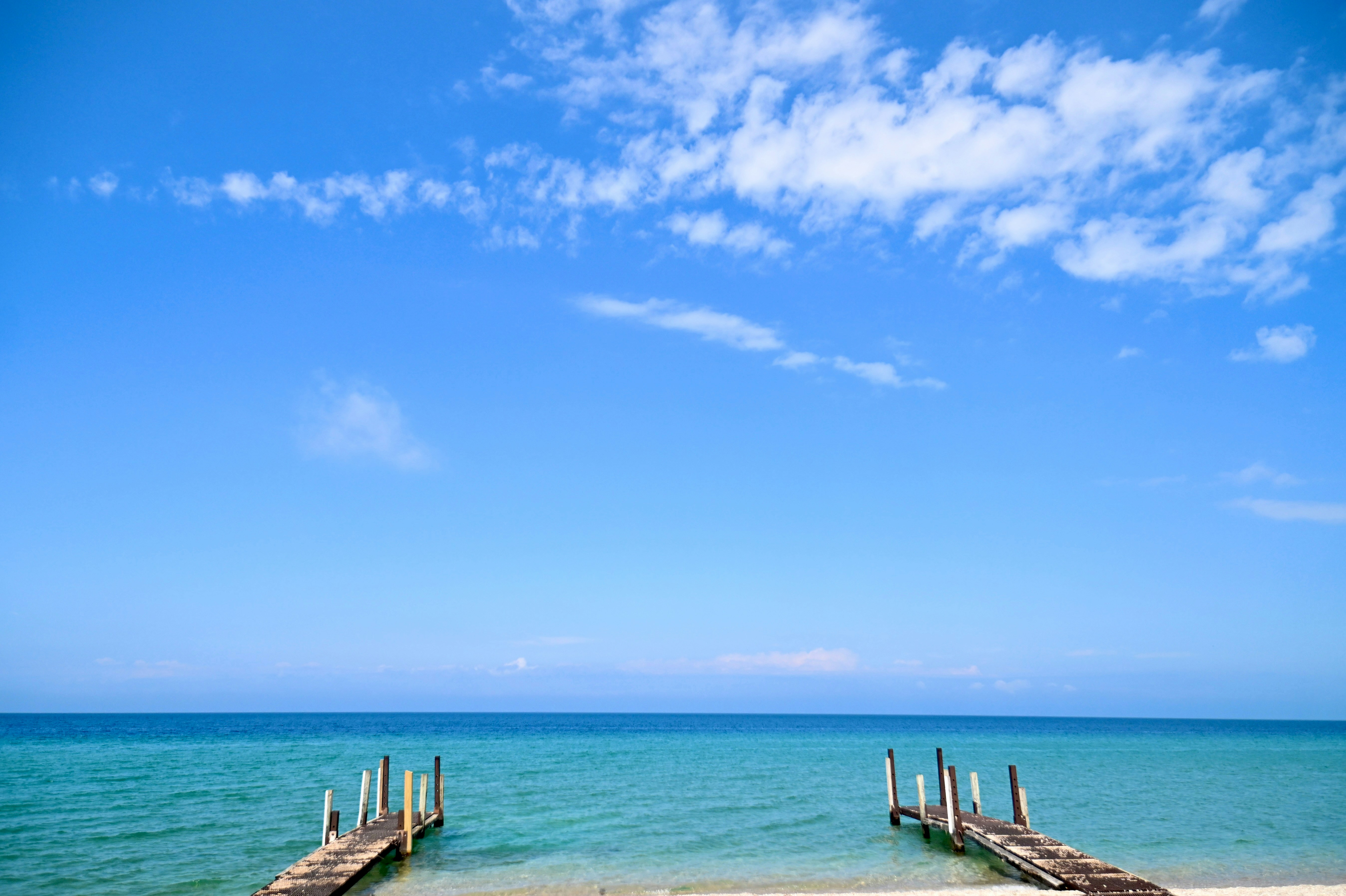 Symmetrical Pier Converges Into a Quiet Sea