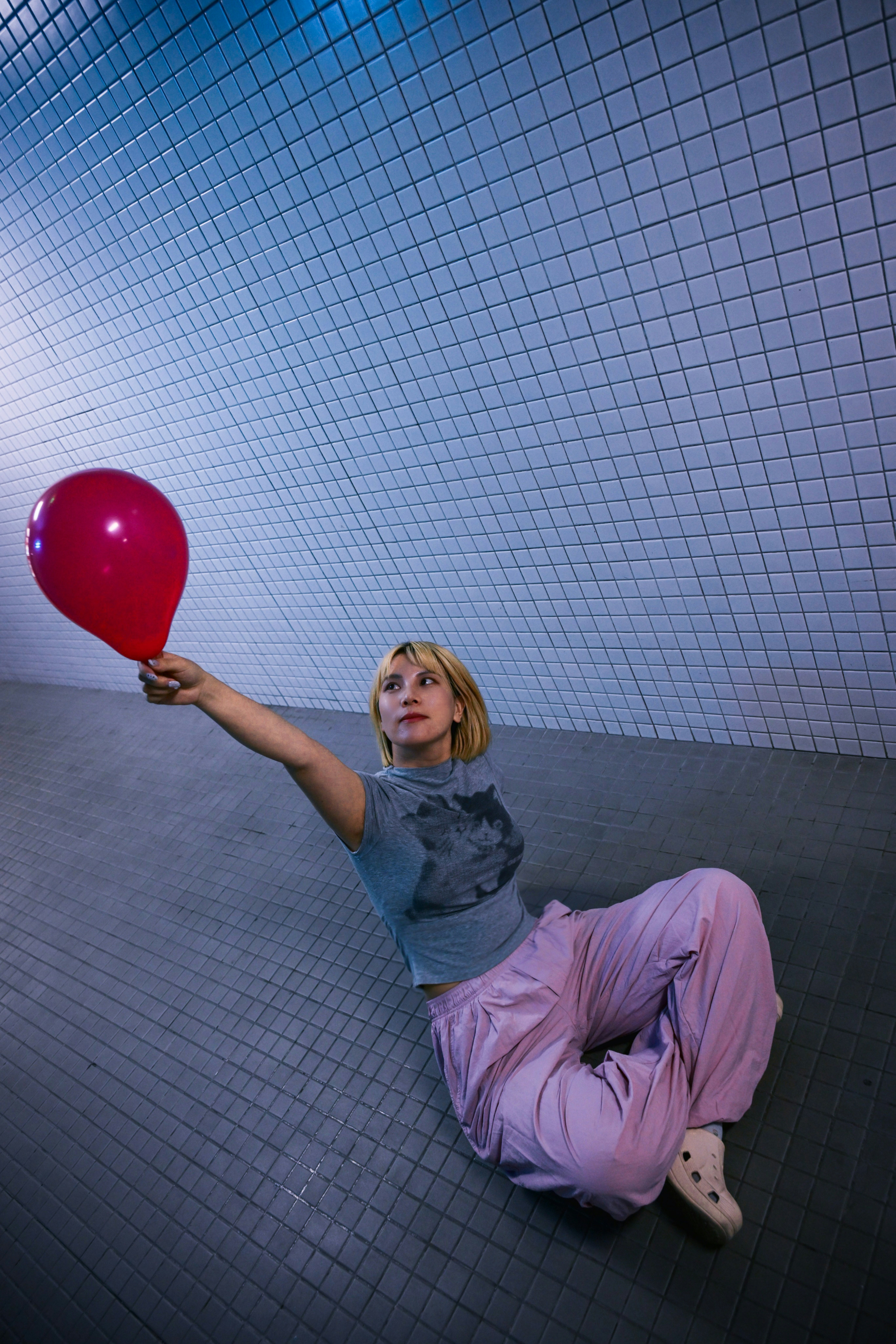 Balloon Serenade in a Tiled Atrium
