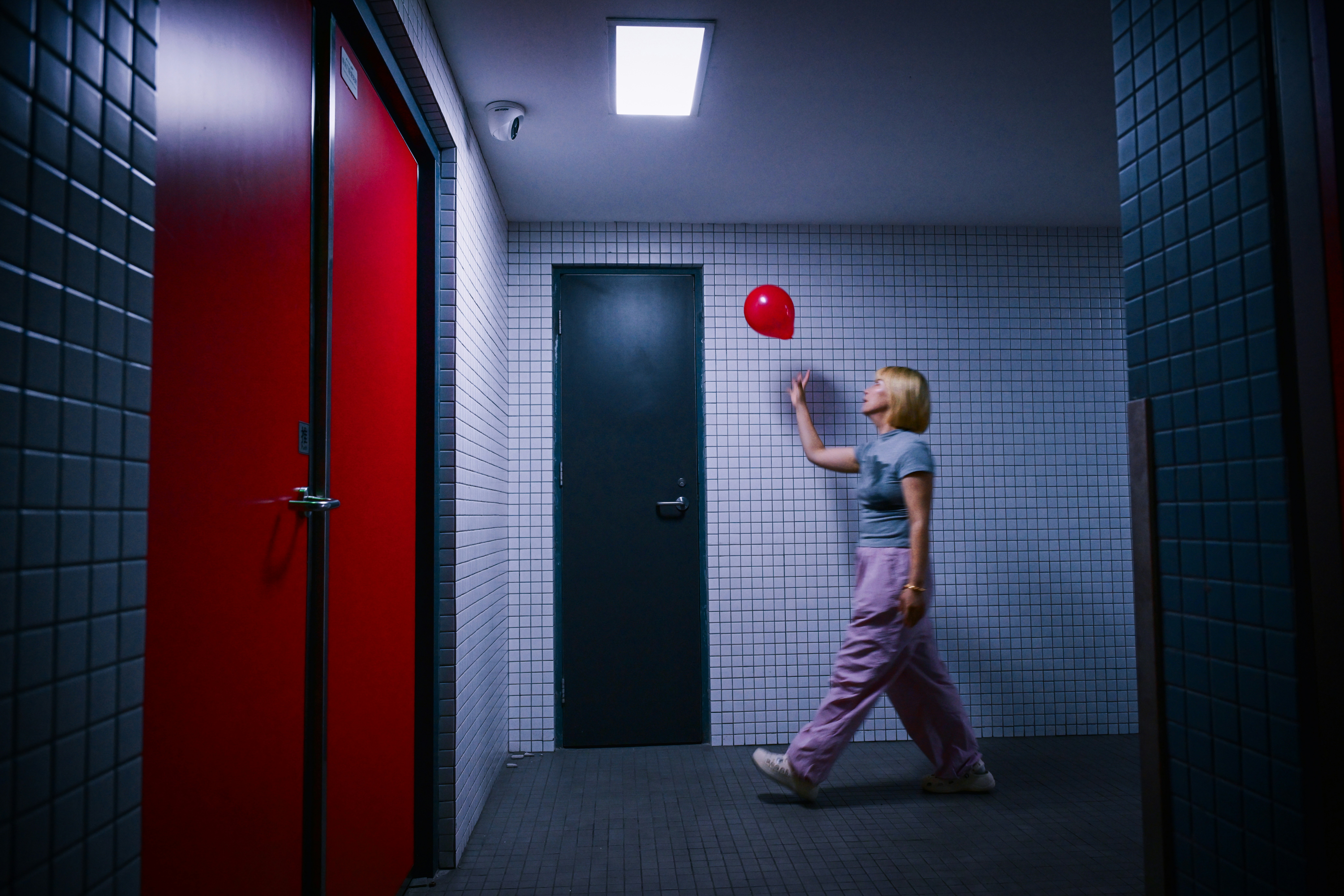 Red Balloon in a Neon Corridor