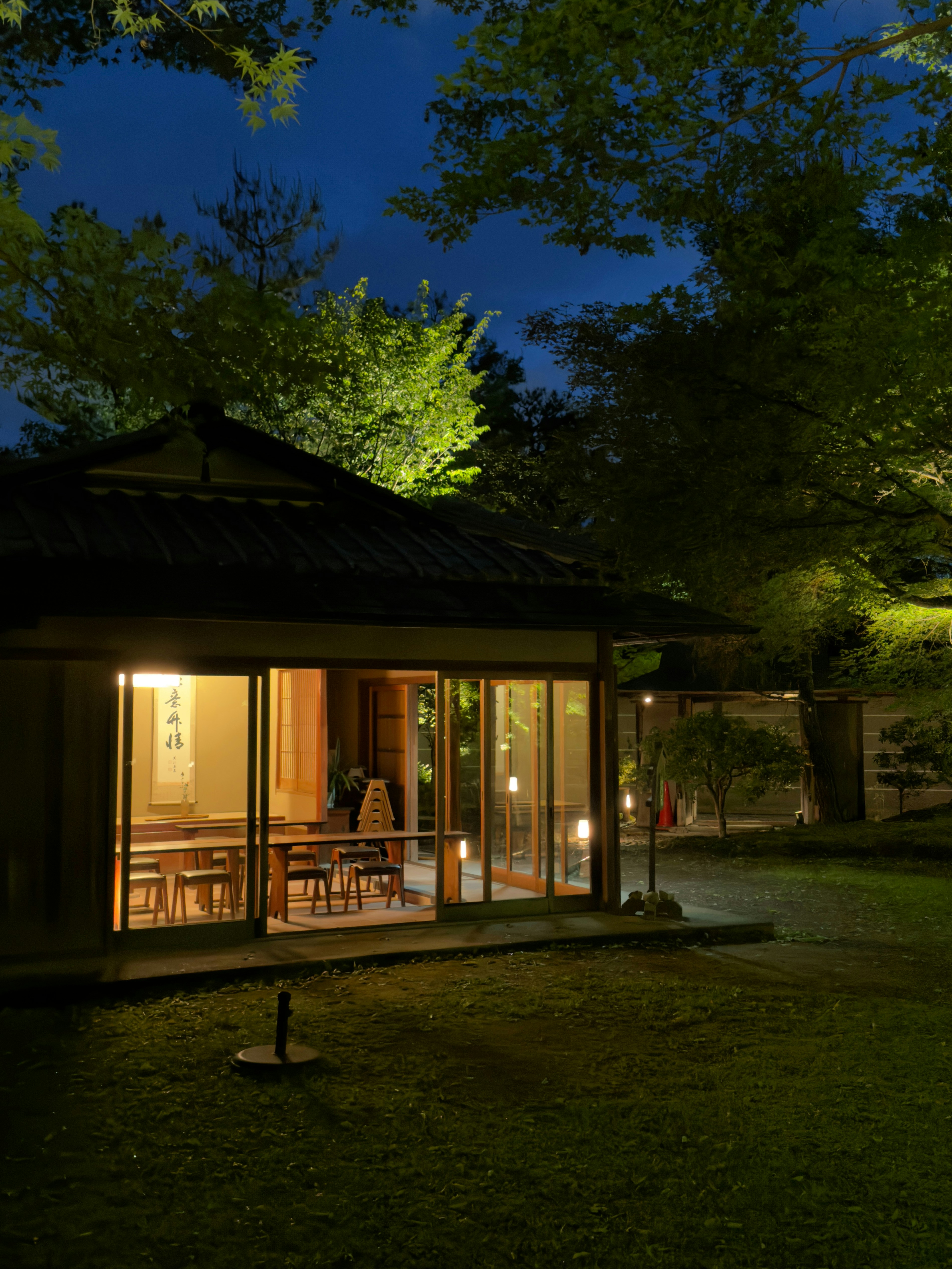 Warm Light Through Glass: Night Scene at a Tranquil Teahouse