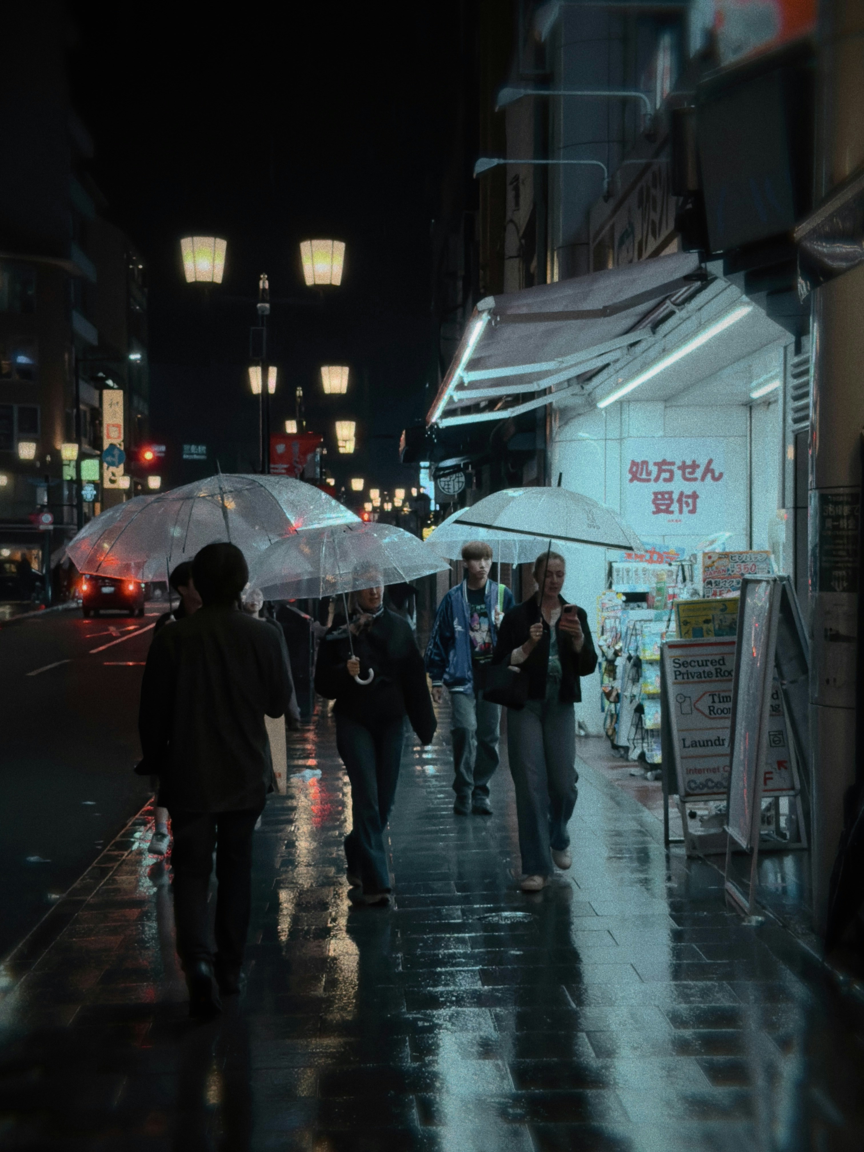 Rain-Kissed Neon Street: Night Walk Under Umbrellas