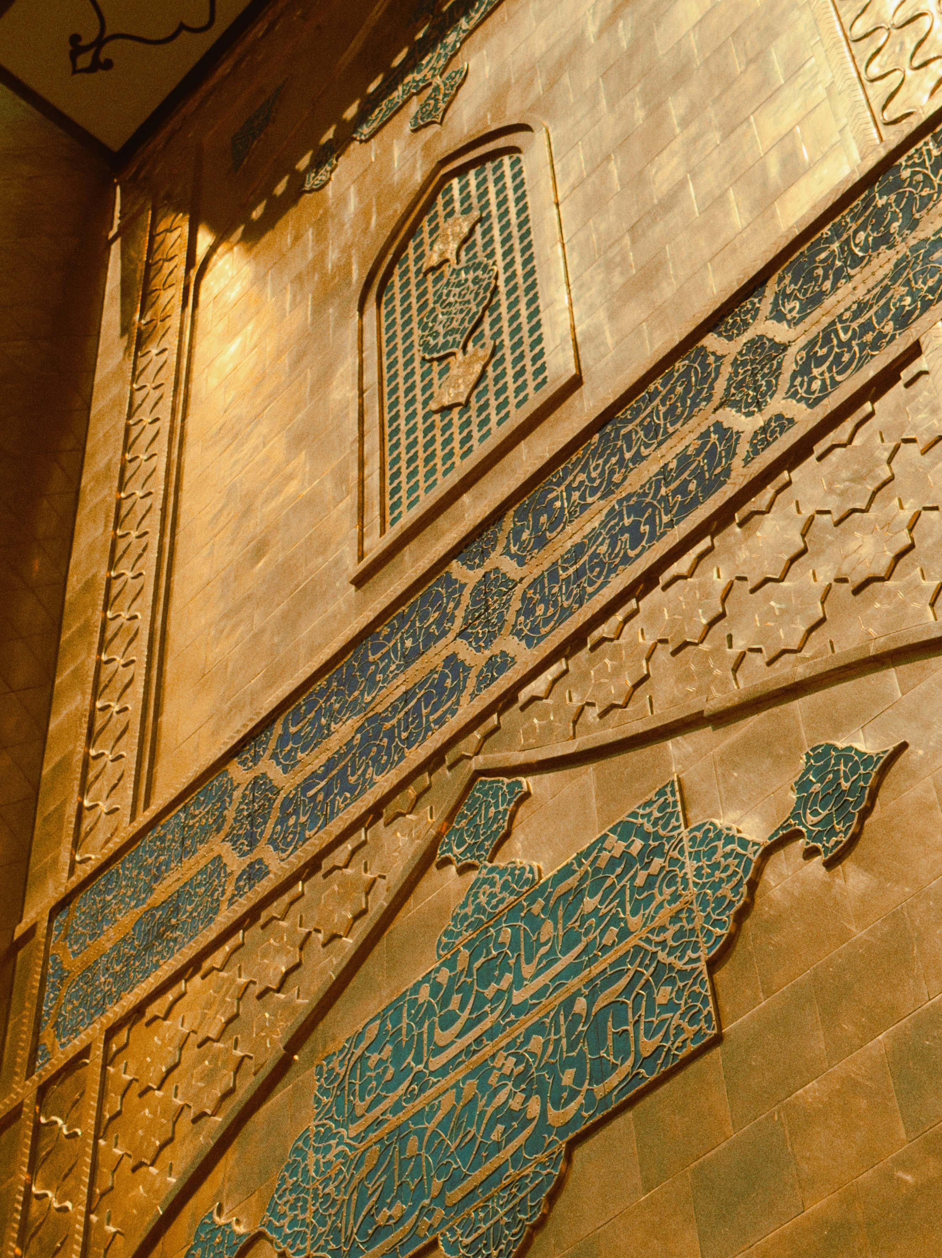 Ornate Tilework on a Sunlit Facade