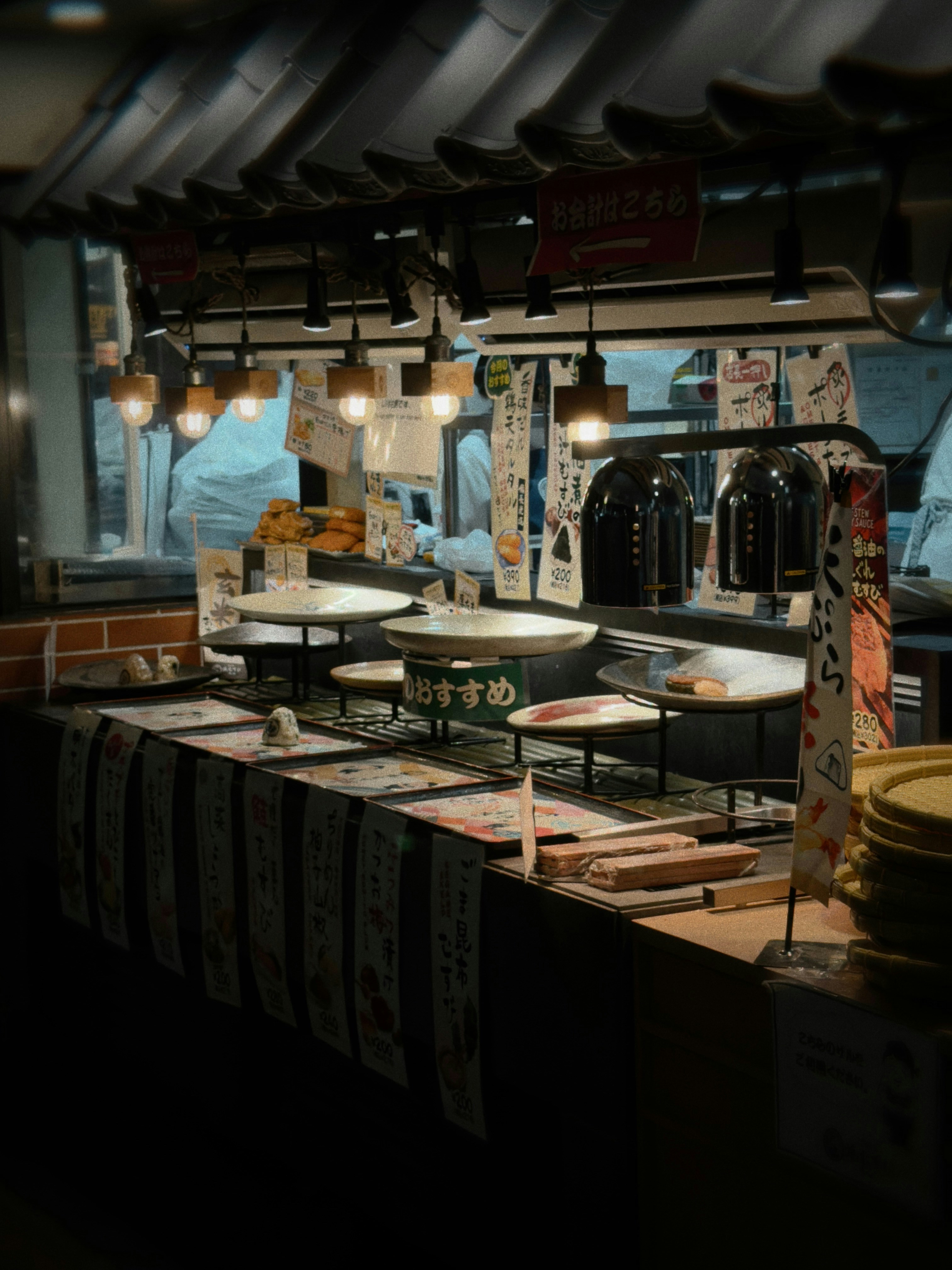 Night Market Delicacies: An Illuminated Sushi Bar in Soft Focus