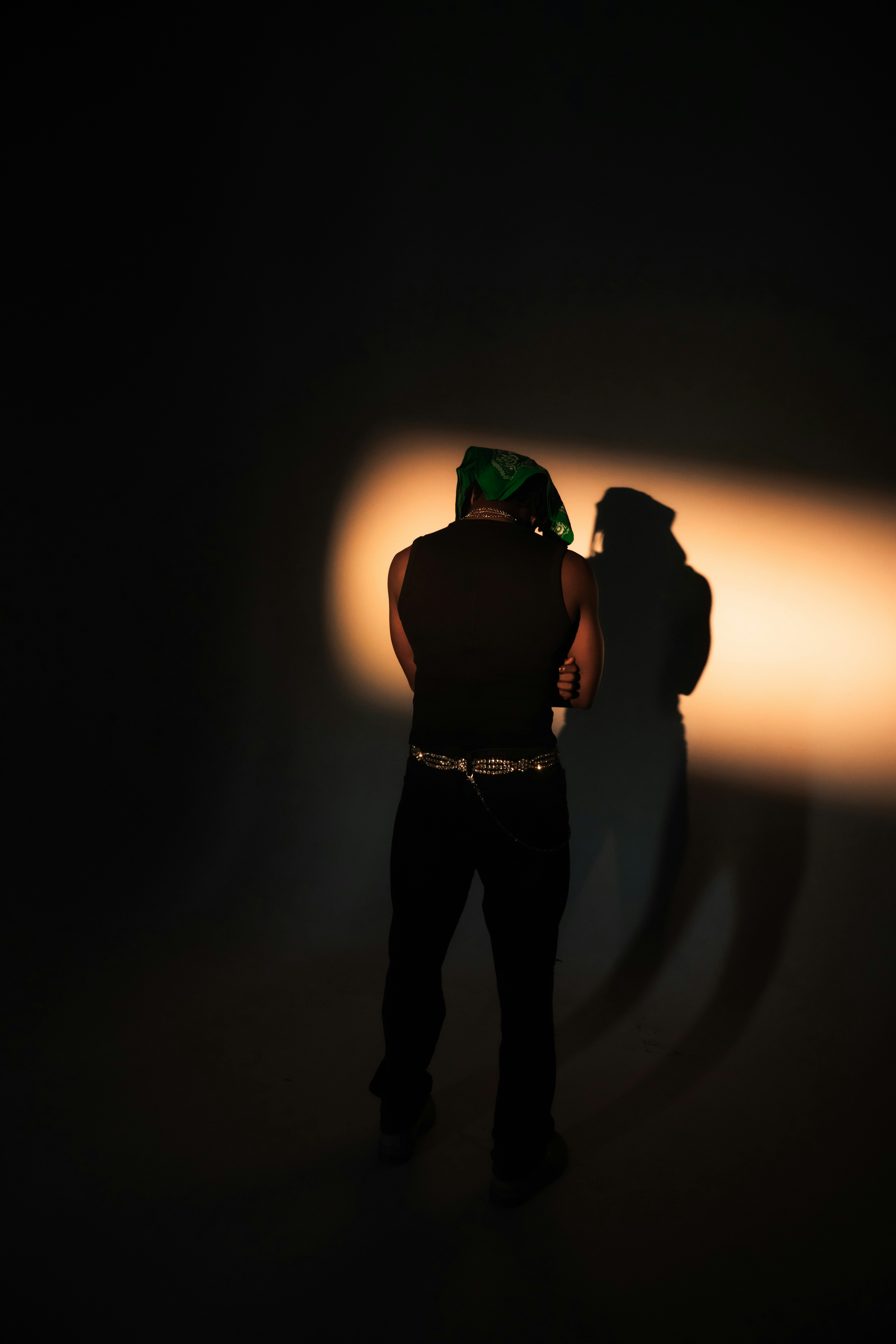 Backlit silhouette in a spotlight vignette
