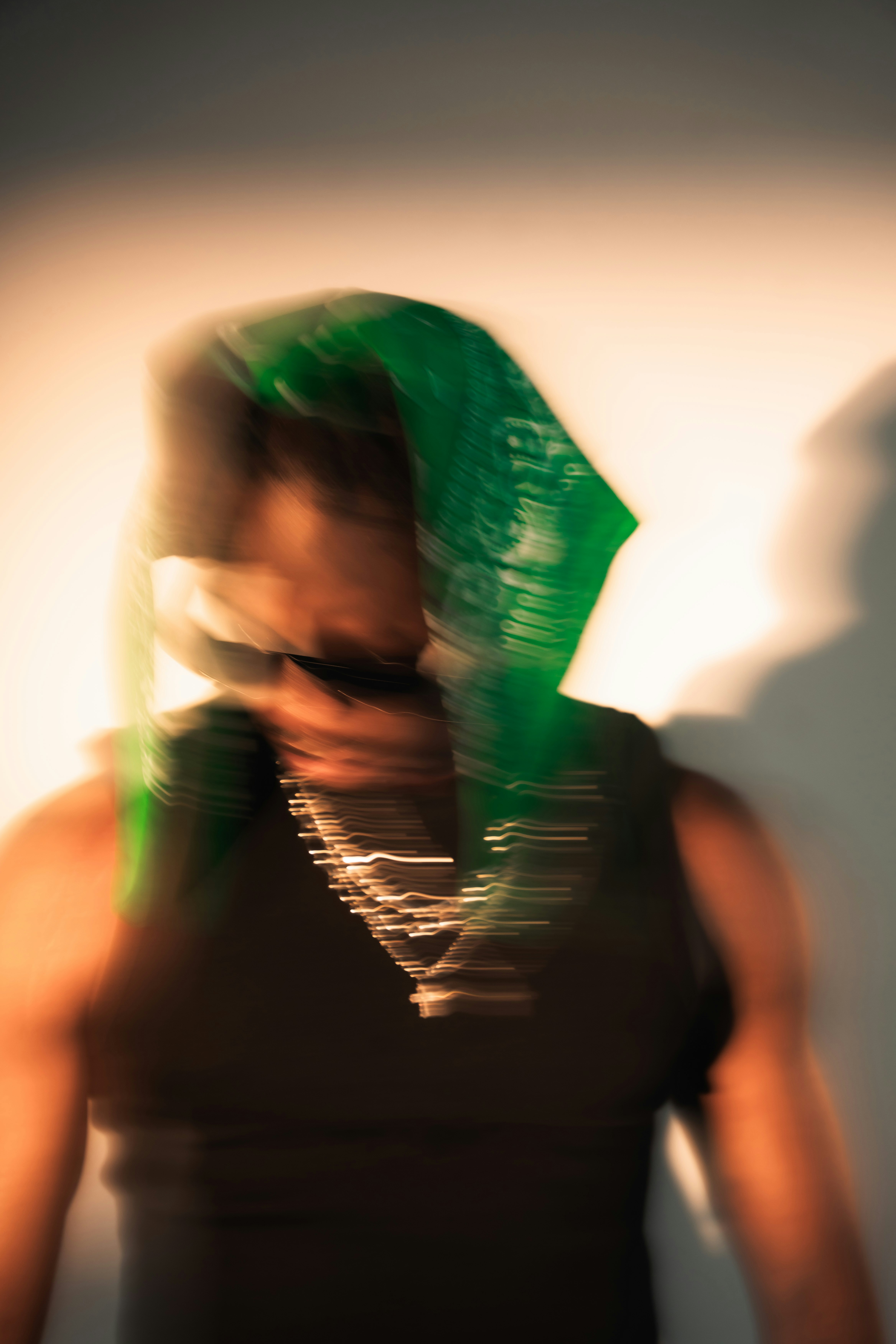 Green Hooded Blur: A Portrait of Motion and Mystery