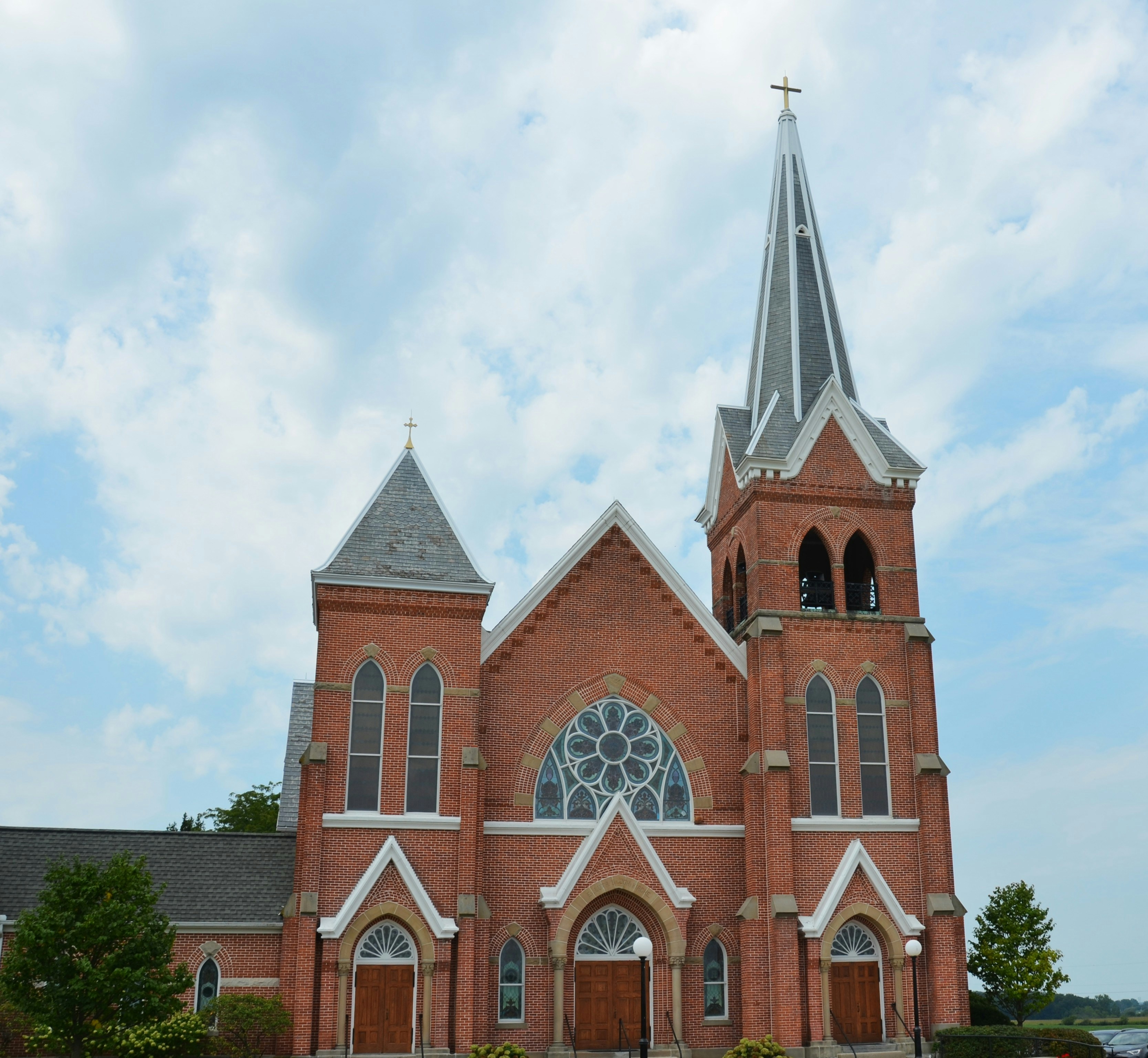 Red Brick Church rising to a pale blue sky