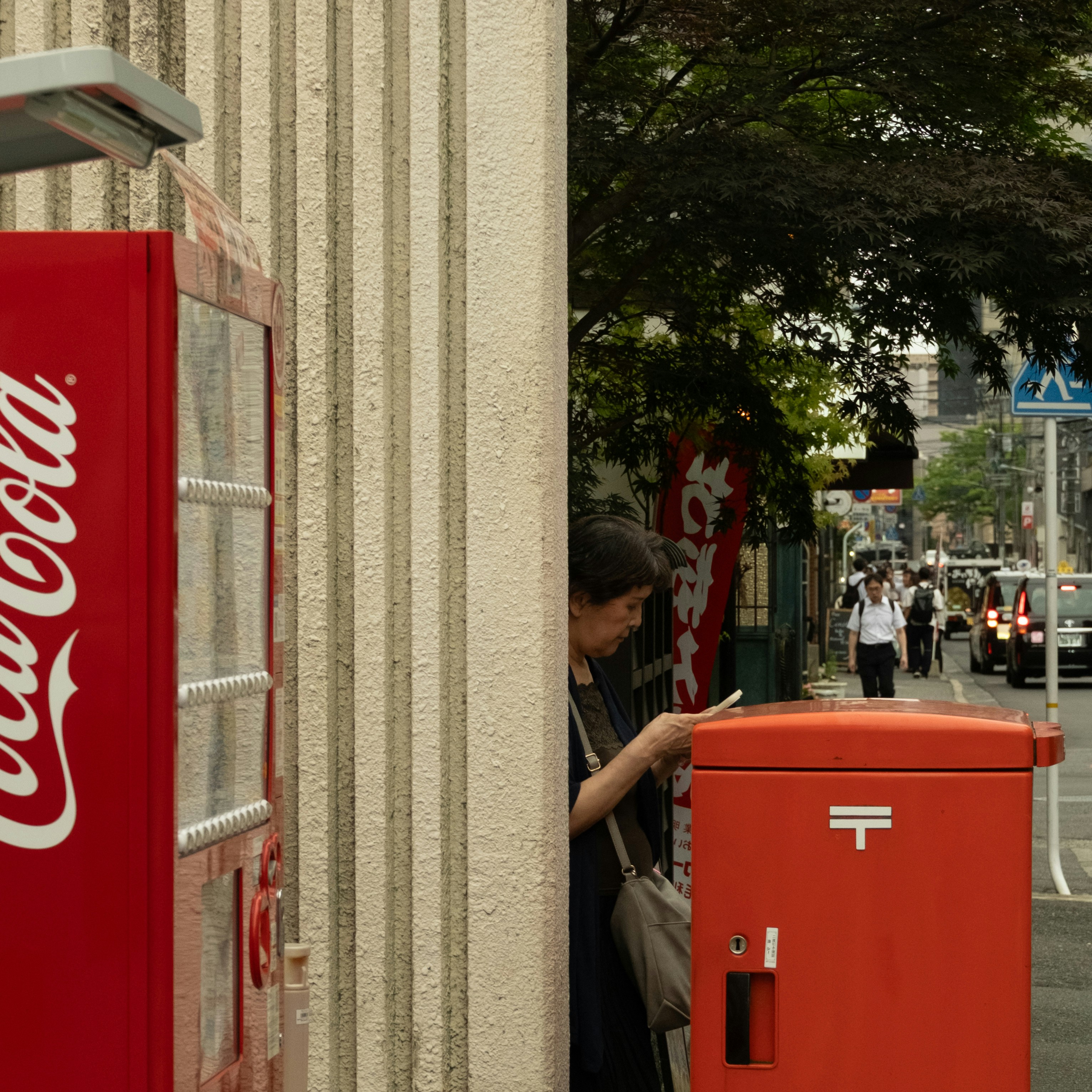 Street Corner Vignette: A Quiet Pause by the Red Post Box