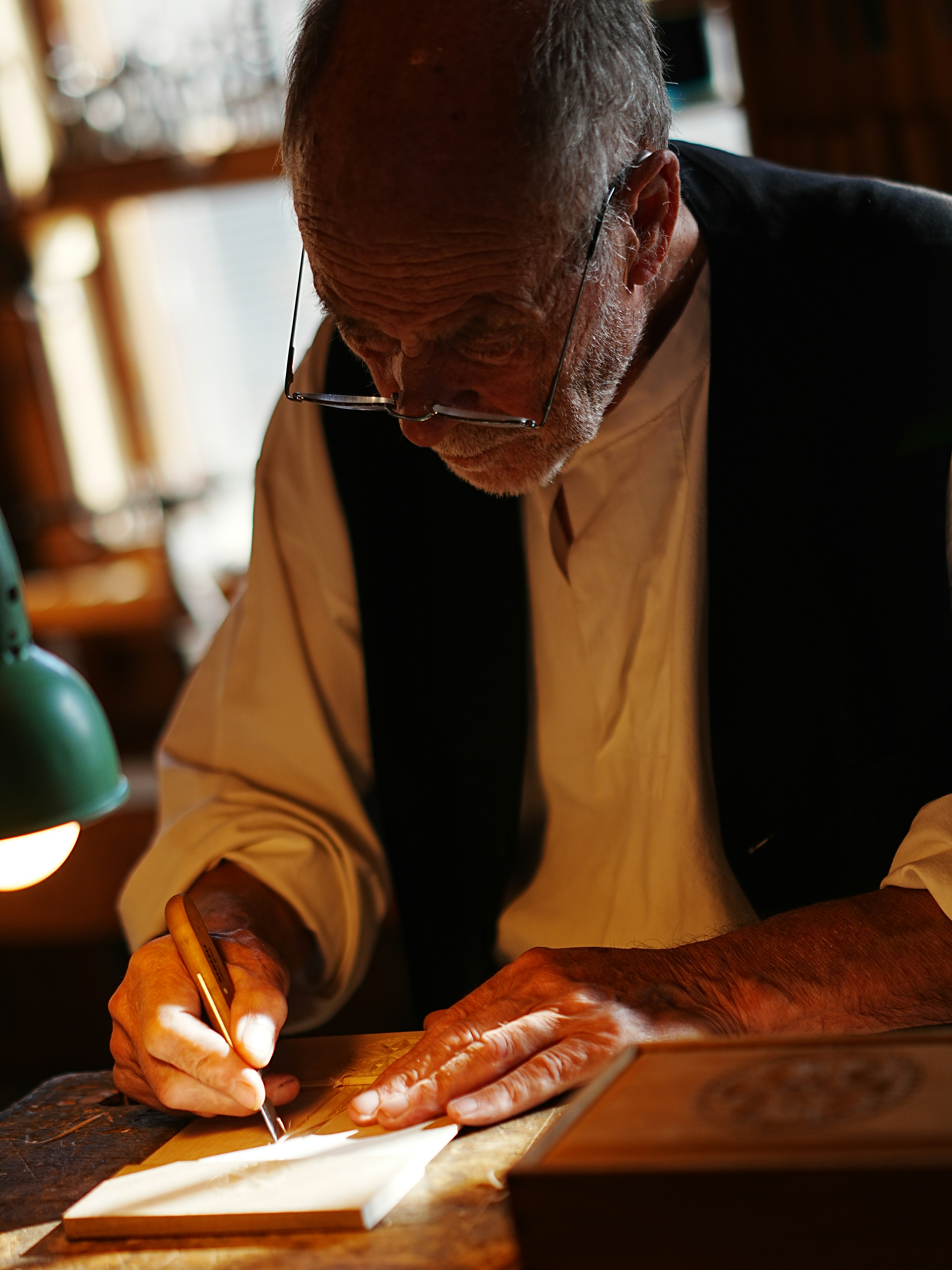 The Quiet Scribe: hands guiding ink beneath the scholar’s gaze