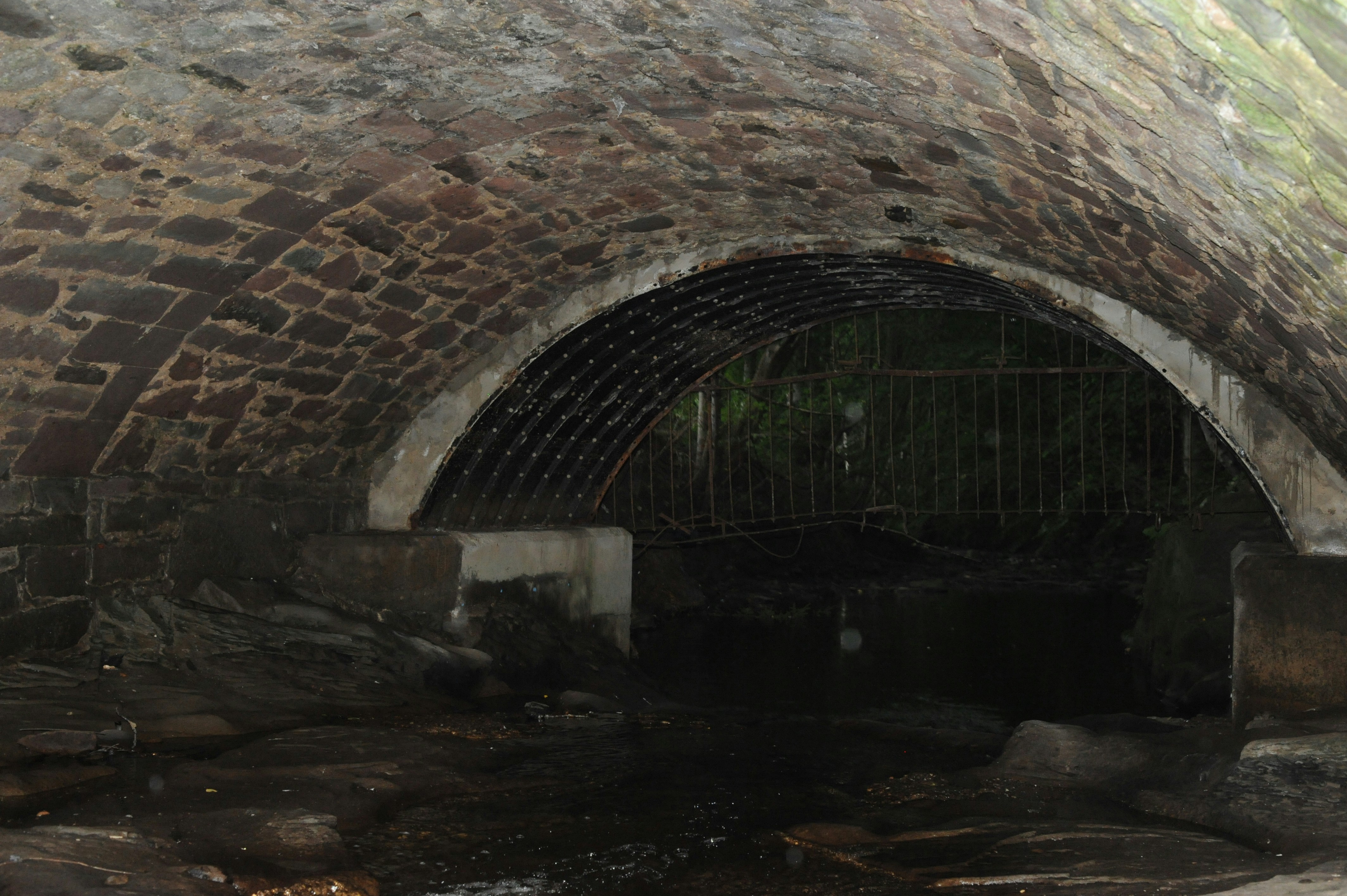 Shadowed Arch Under the Brick Bridge
