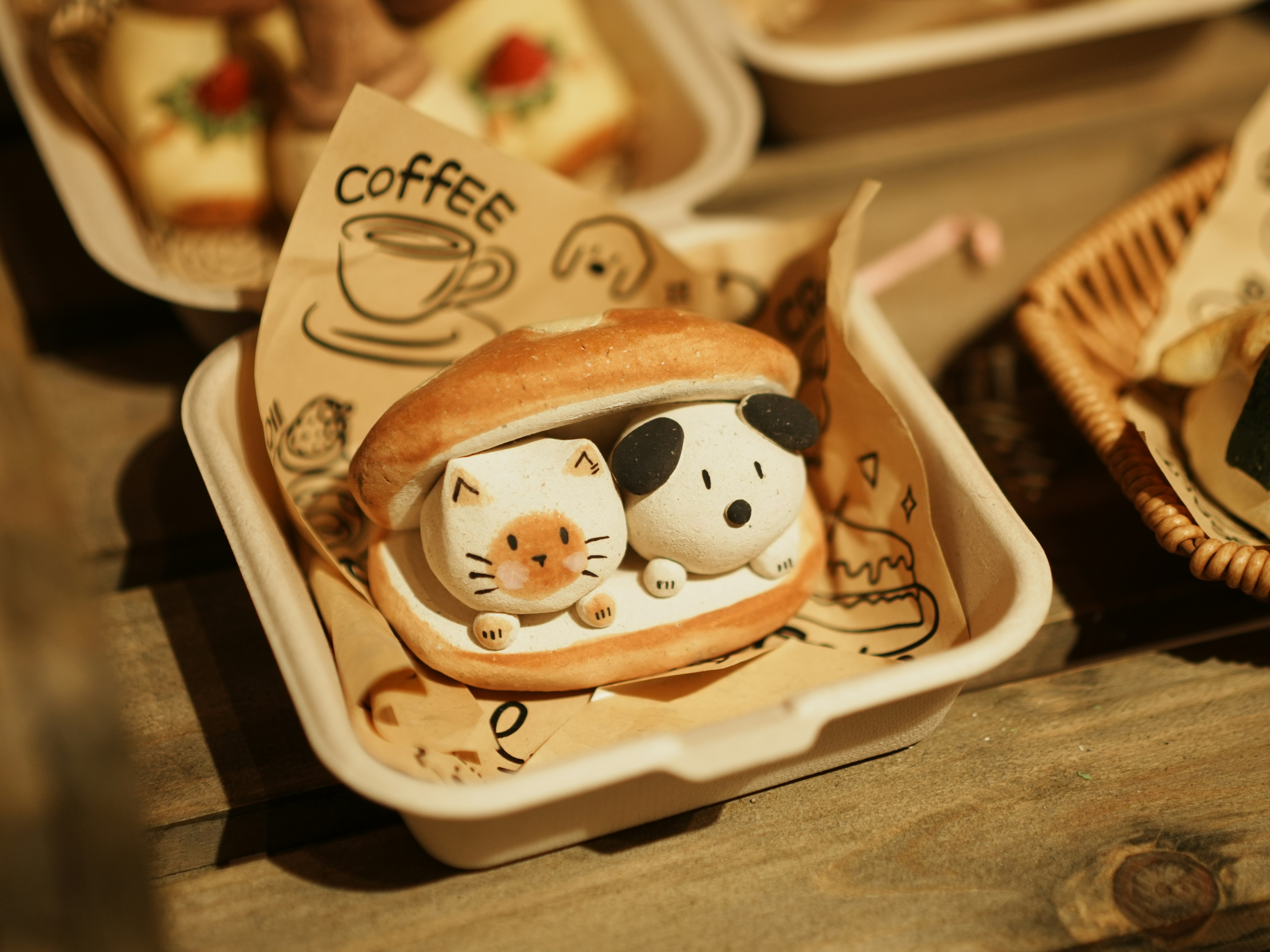 Tiny duo tucked inside a coffee-bloom bun