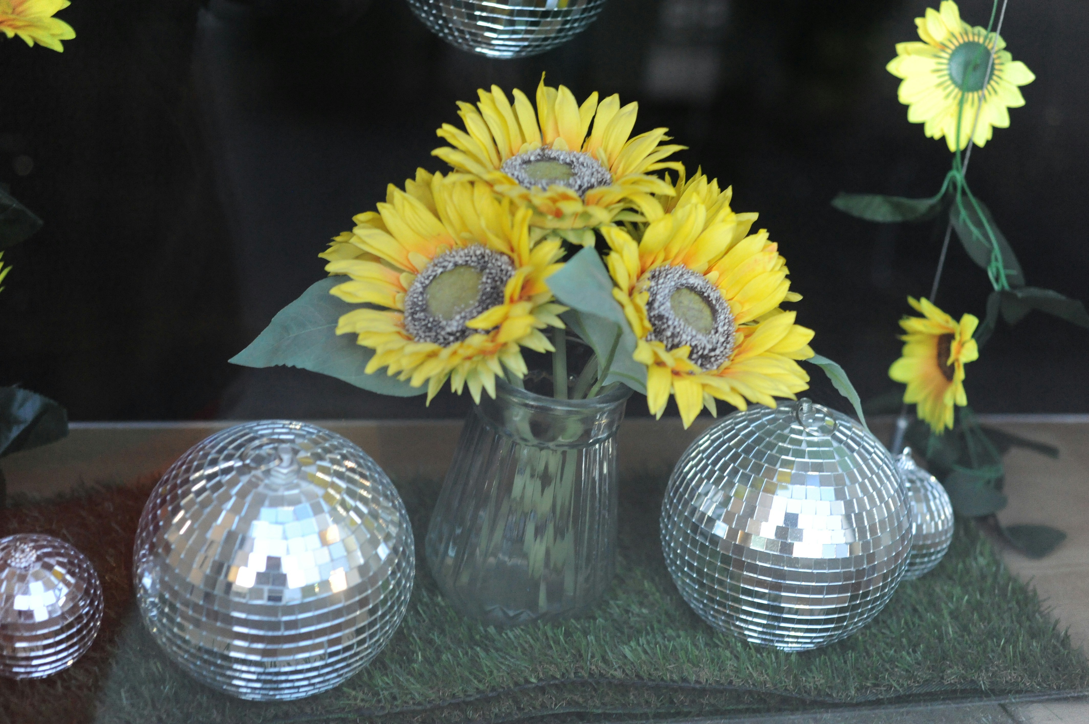 Sunlit Sunflowers in a Glass Vase with Mirror Orbs