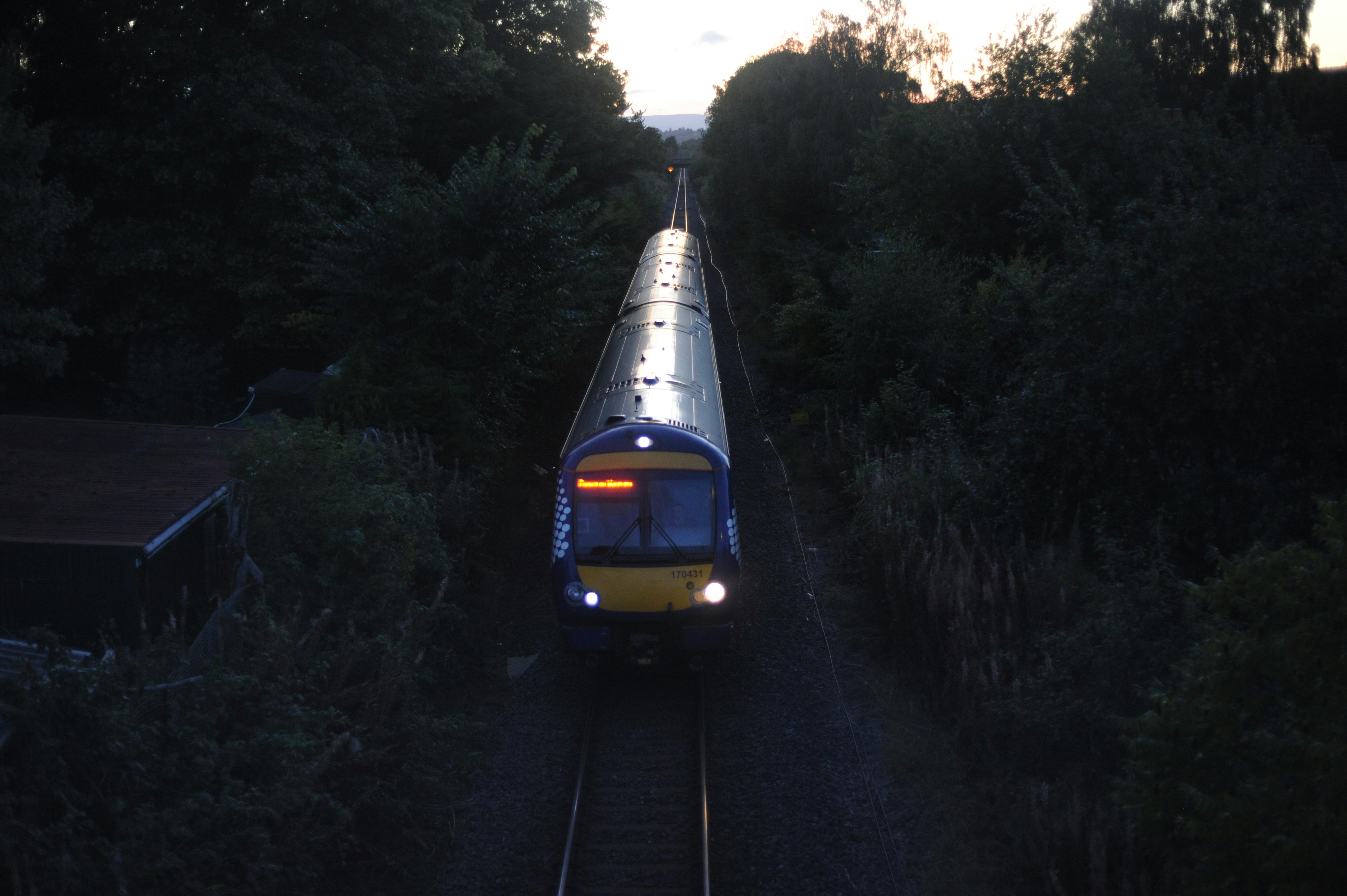 Evening Express: A Lone Passenger Train Surges Through Quiet Dark
