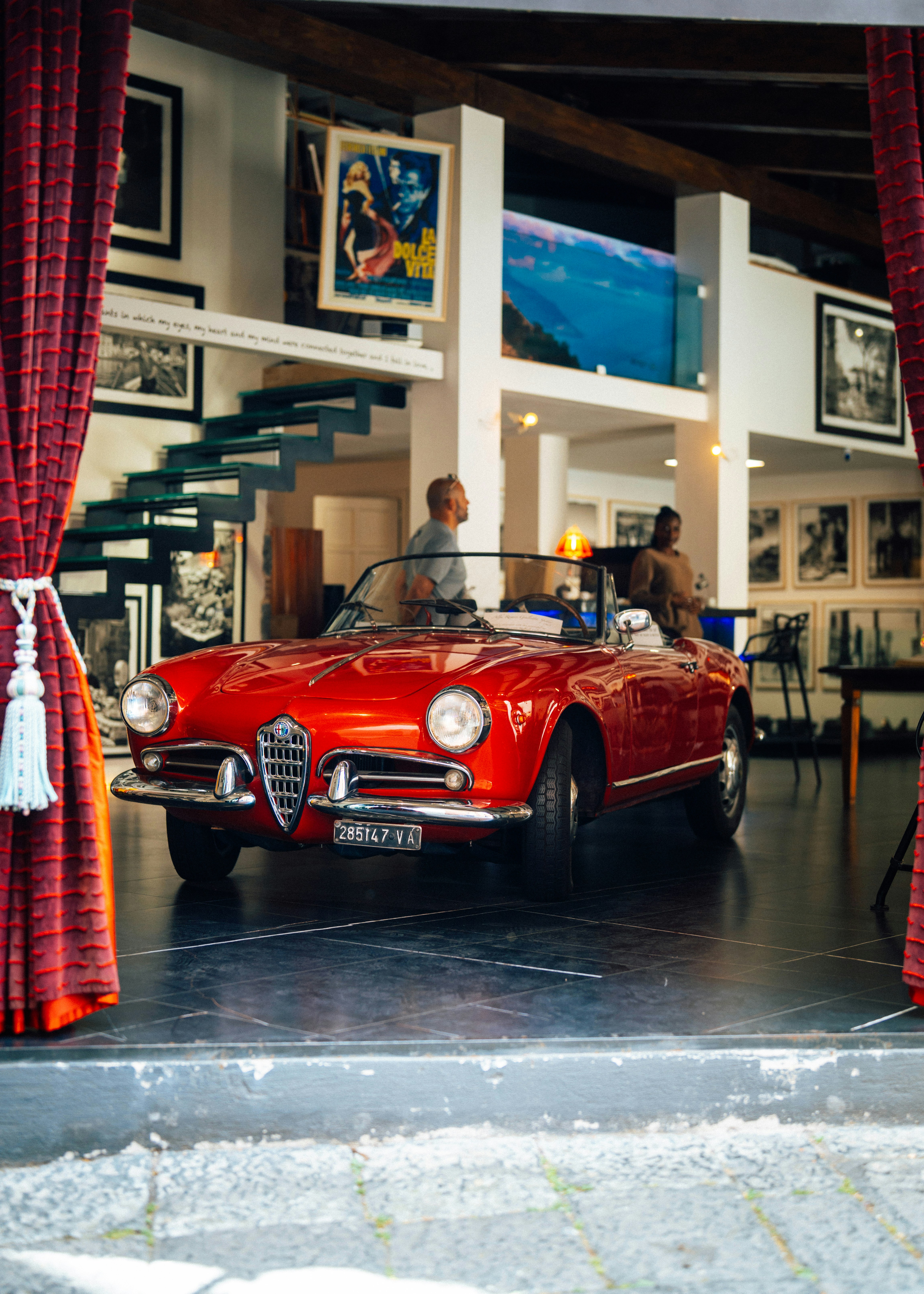 Red Classic Convertible in a Gallery Hall